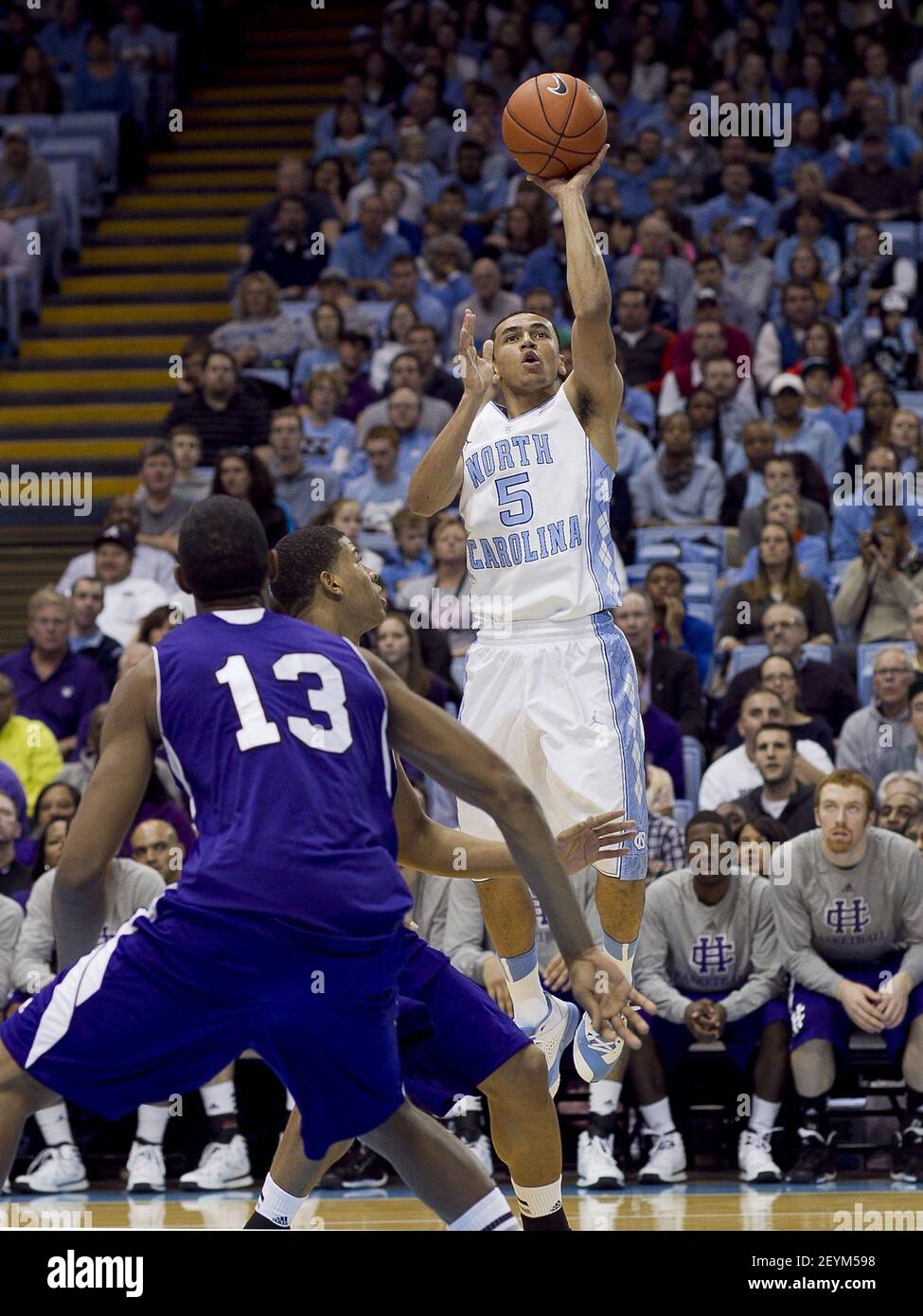 Marcus Paige (5) of North Carolina puts up a shot over Malcolm Miller ...