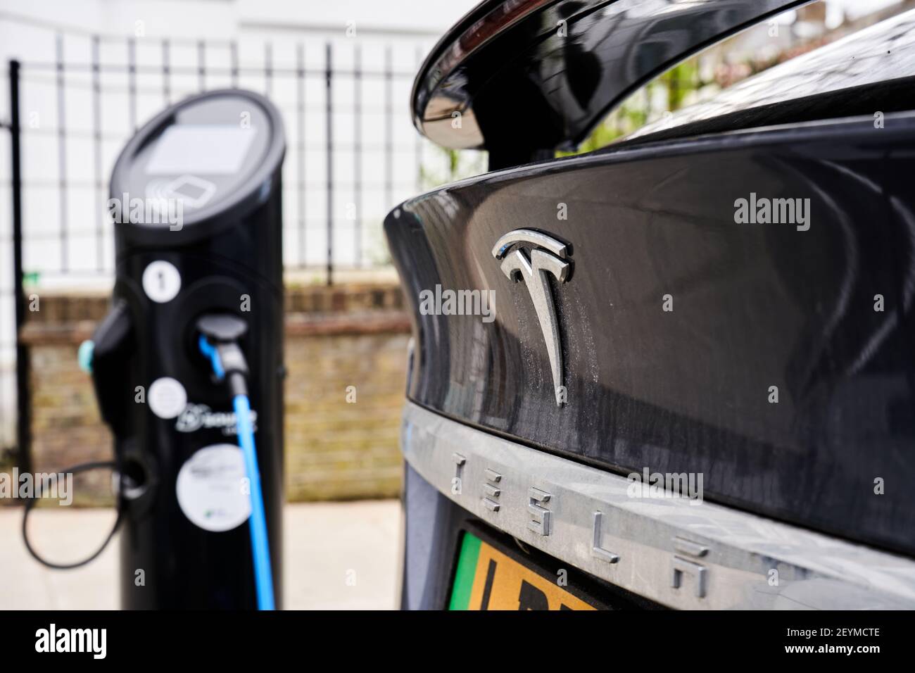 A Tesla car using a Source London EV charging point, London. Picture ...