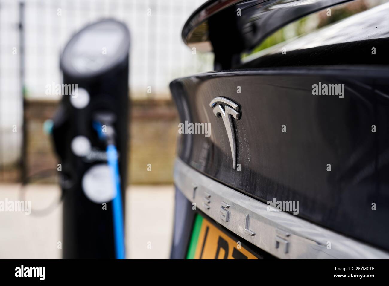 A Tesla car using a Source London EV charging point, London. Picture ...