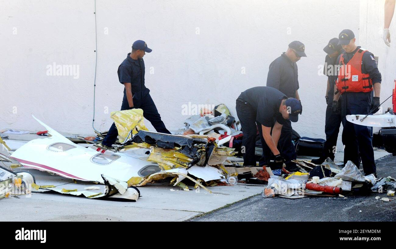 The U.S. Coast Guard unloads pieces of the Learjet 35 on Wednesday, Nov ...