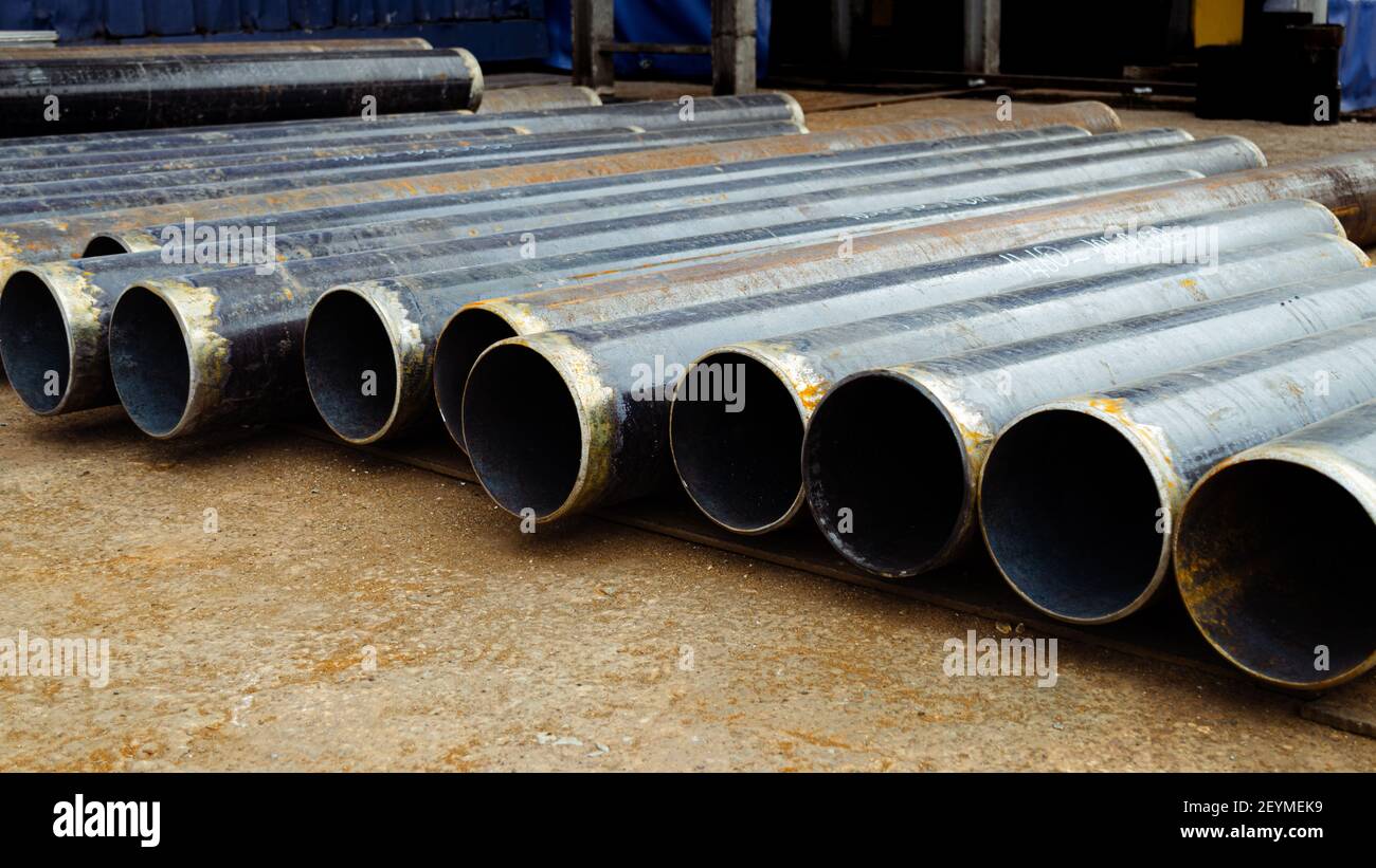 Raw Pipes Material Black Steel Laying on the Ground Stock Photo - Alamy