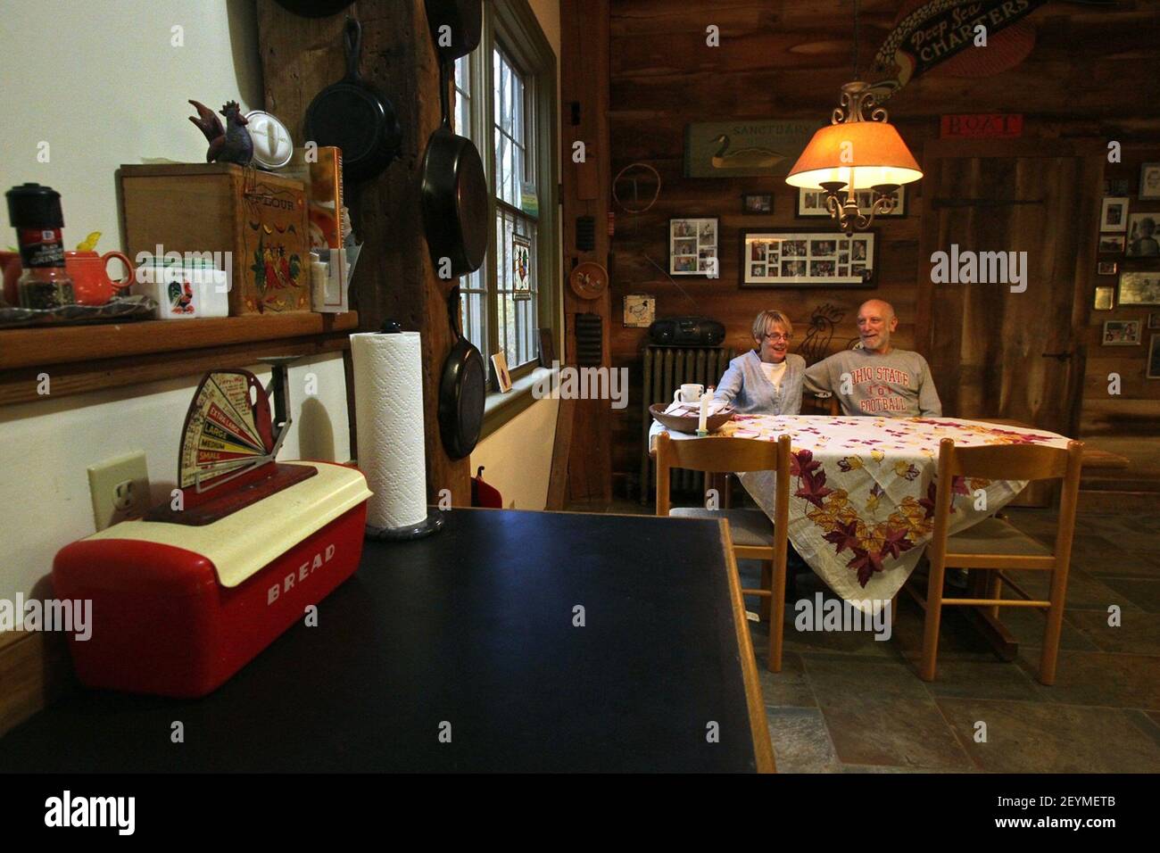 Nancy Angerman, left, and her husband, Tom Hutter, sit in the kitchen ...