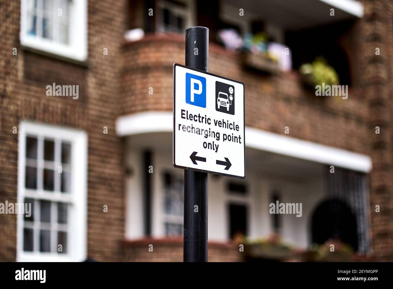 Electric vehicle signage at a Source London EV charging station, London ...