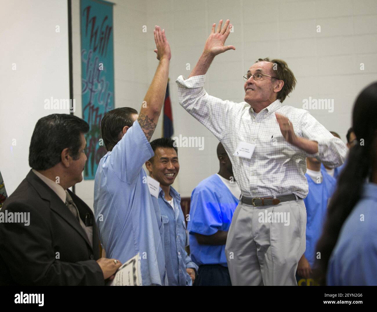 Volunteer Phil Towle, right, high-fives Kid CAT member Charlie Spence ...