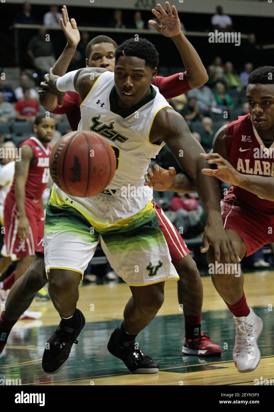 South Florida's Chris Perry (23) and Alabama's Retin Obasohan (32 ...