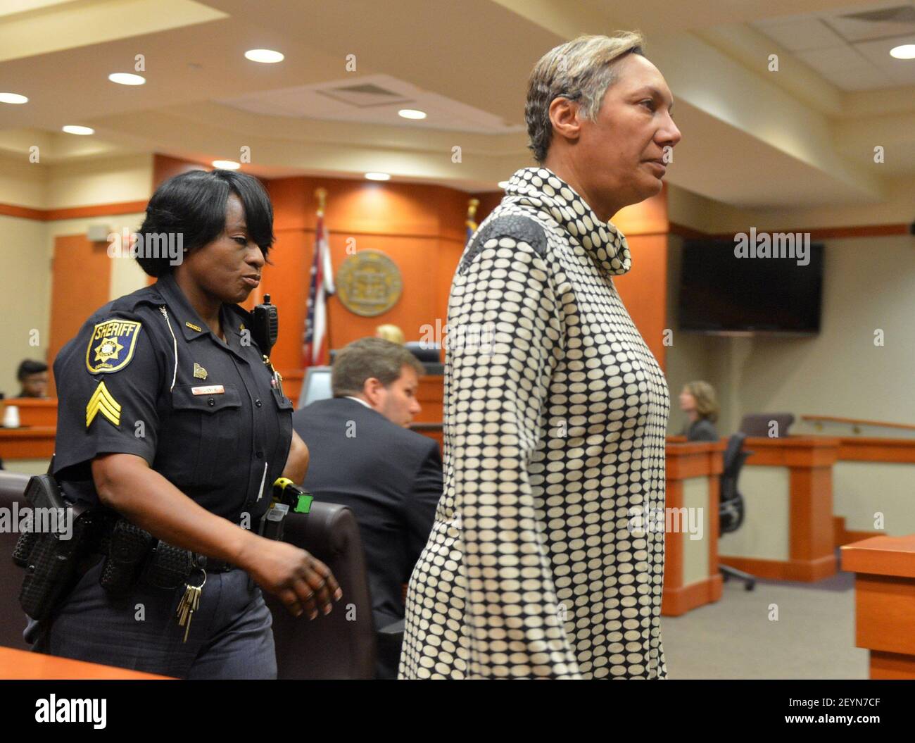 Pat Reid, right, is escorted out of the courtroom after being sentenced ...