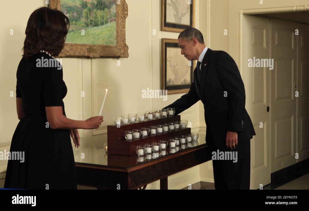 President Barack Obama and First Lady Michelle Obama participate in a ...