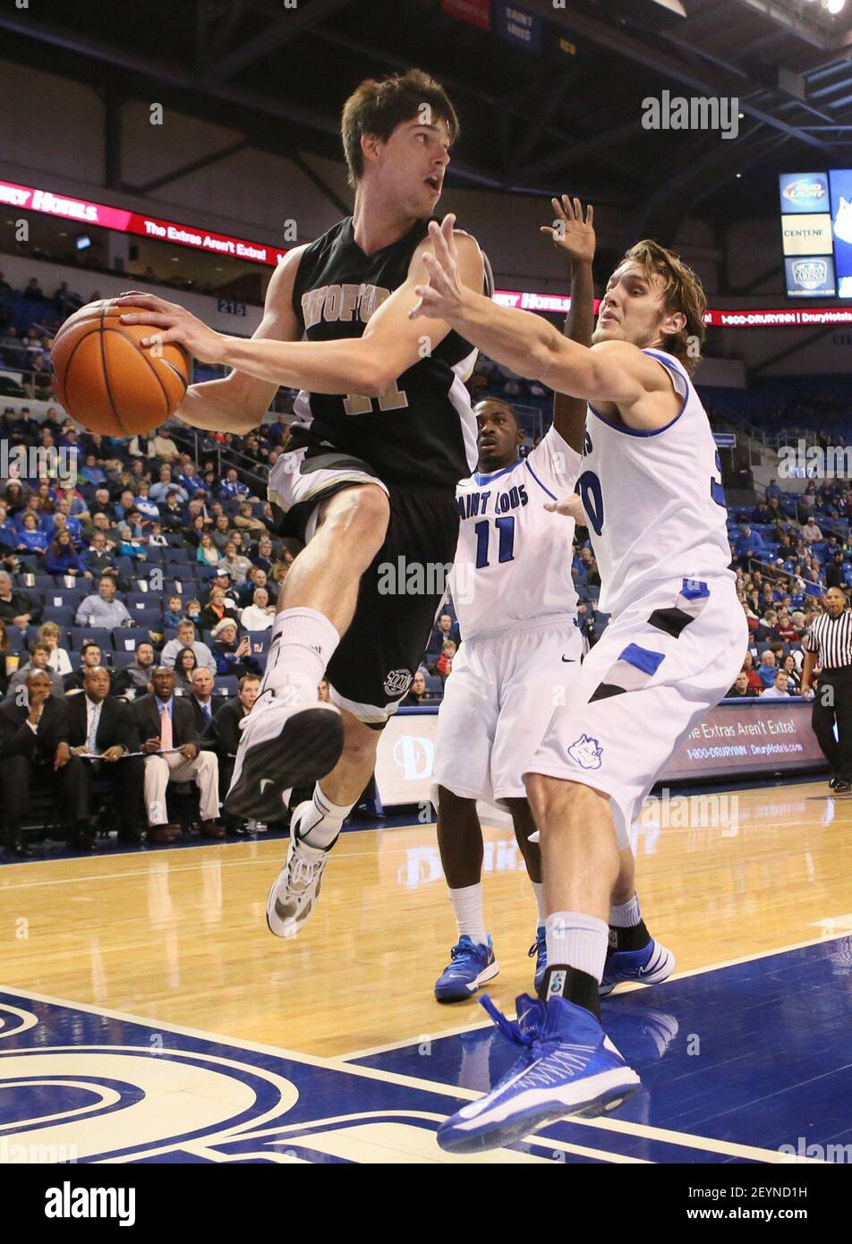 Wofford guard Indiana Faithfull, left, looks to pass as he drives ...