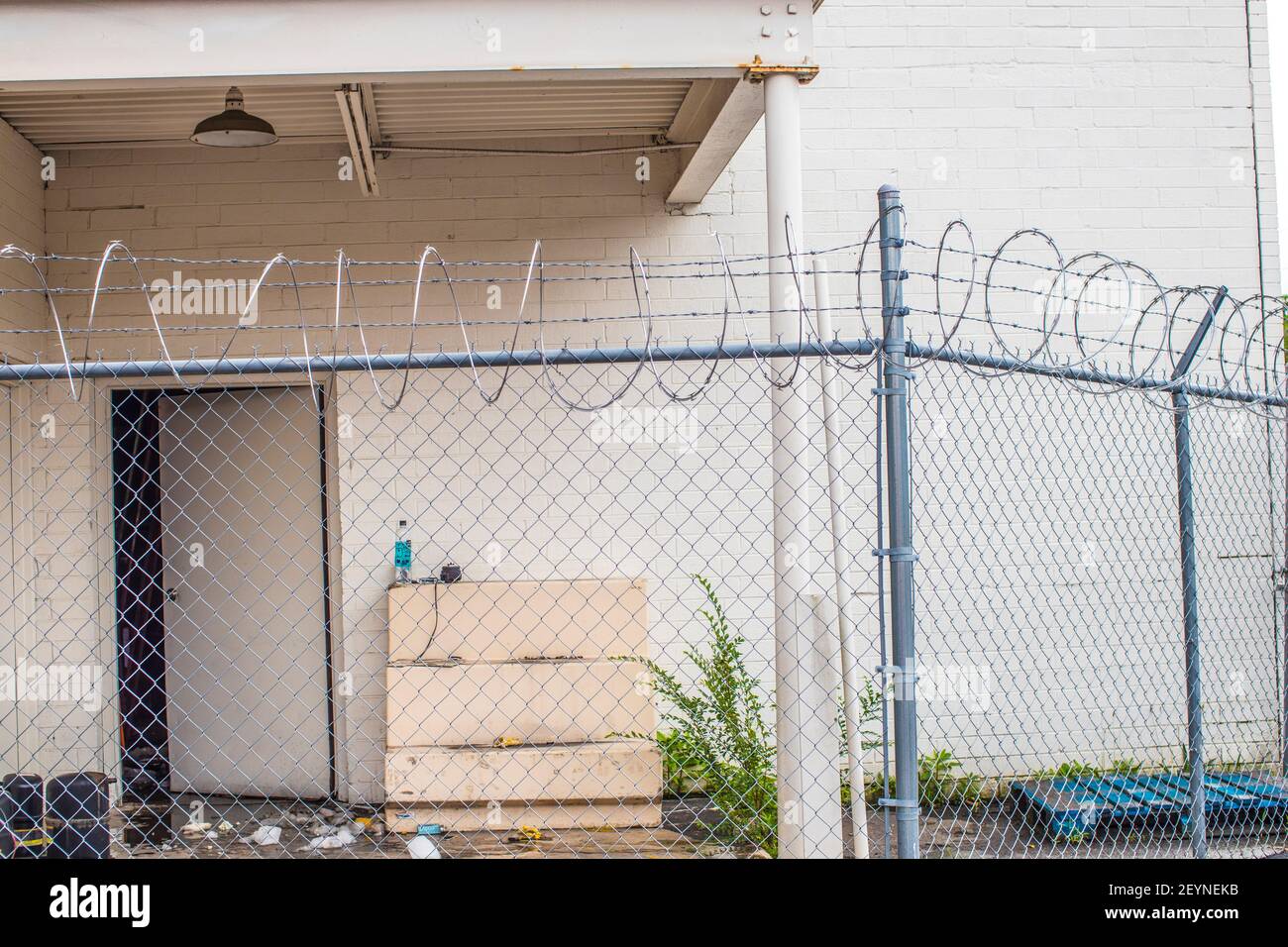 Decatur, Ga / USA - 07 07 20: Fenced in area with an open door and ...