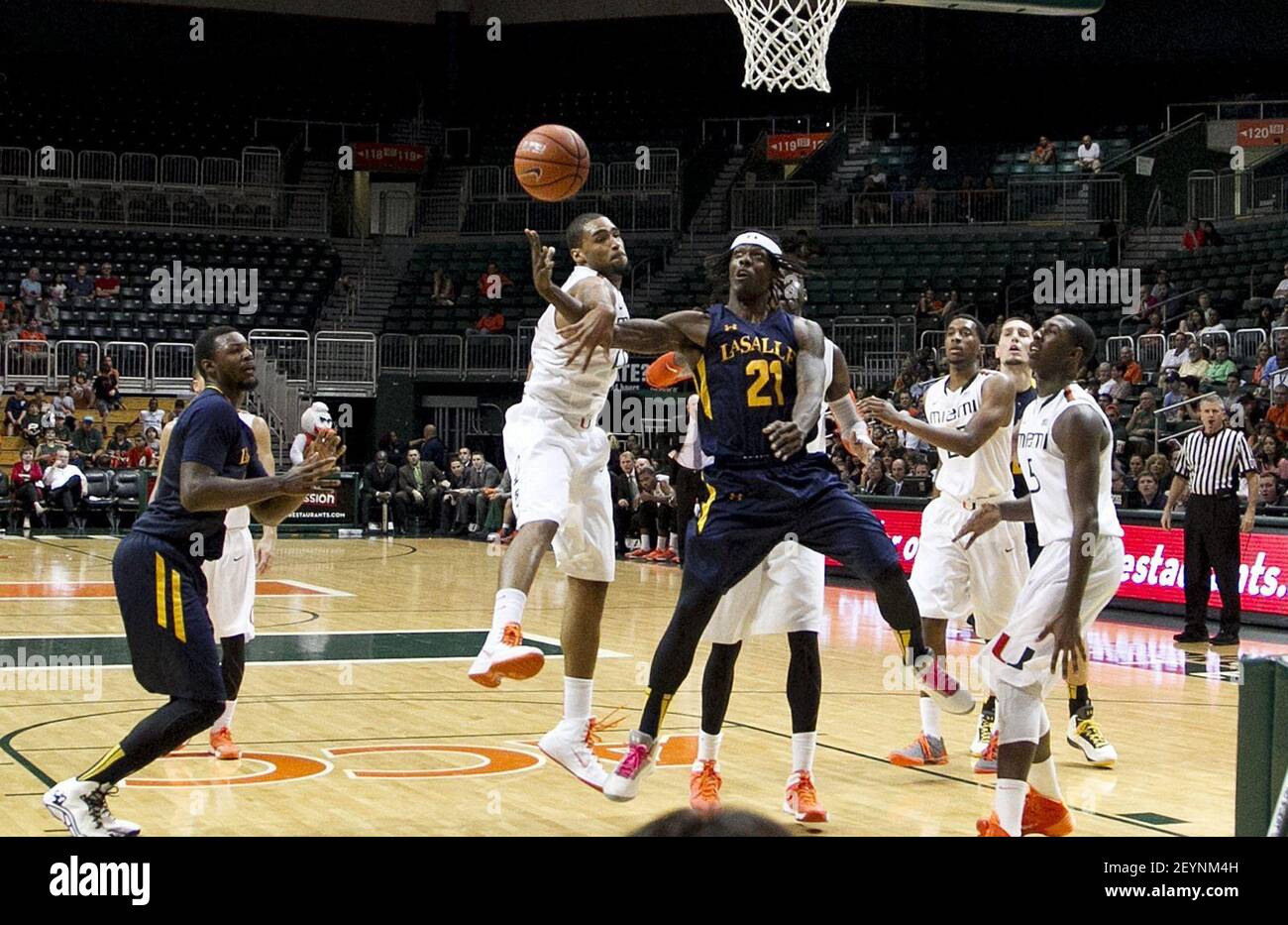 Miami's Donnavan Kirk, center left, fouls La Salle's Tyrone Garland (21 ...