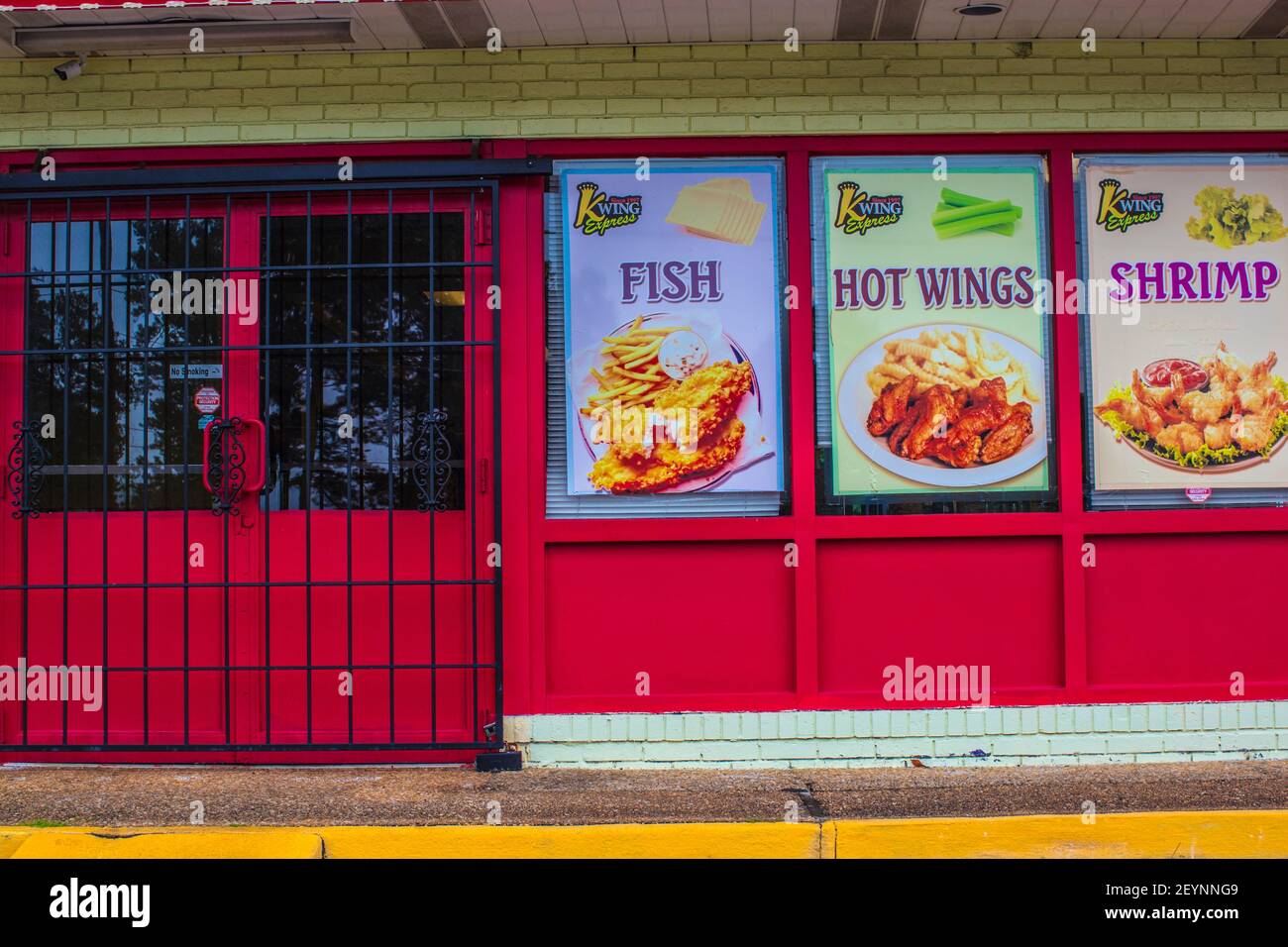 Decatur, Ga / USA - 07 07 20: Locked gated door and brick wall with ...