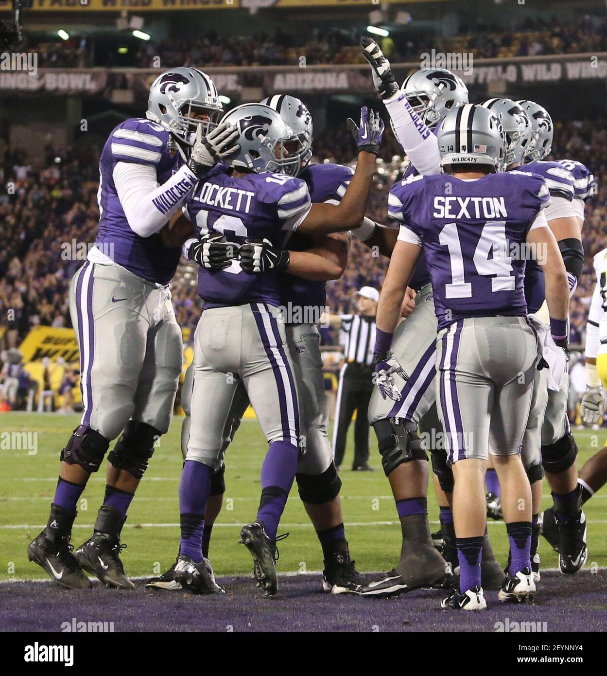 Kansas State wide receiver Tyler Lockett (16) is surrounded by his ...