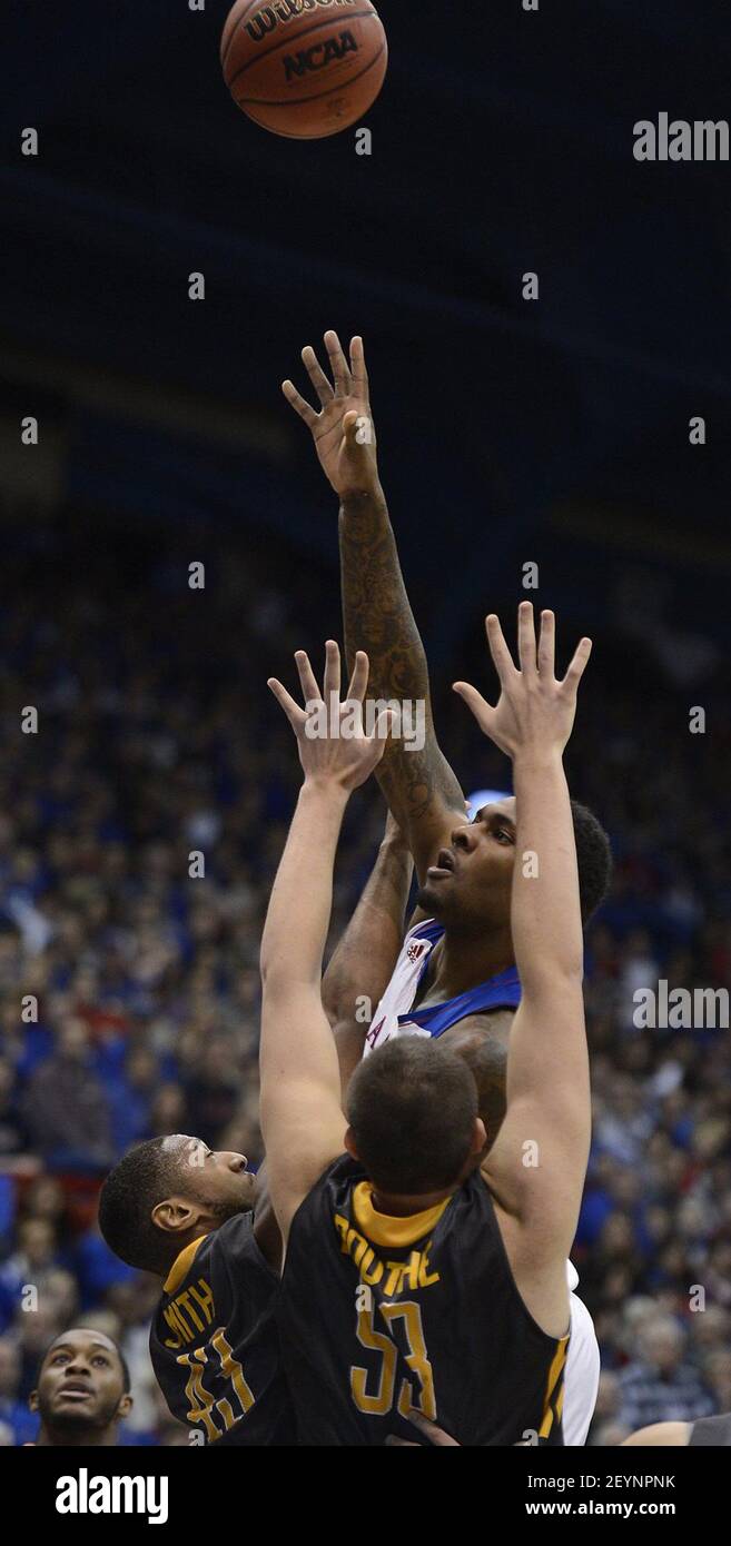 Kansas Jayhawks' Tarik Black puts up a shot over Toledo Rockets' Matt ...