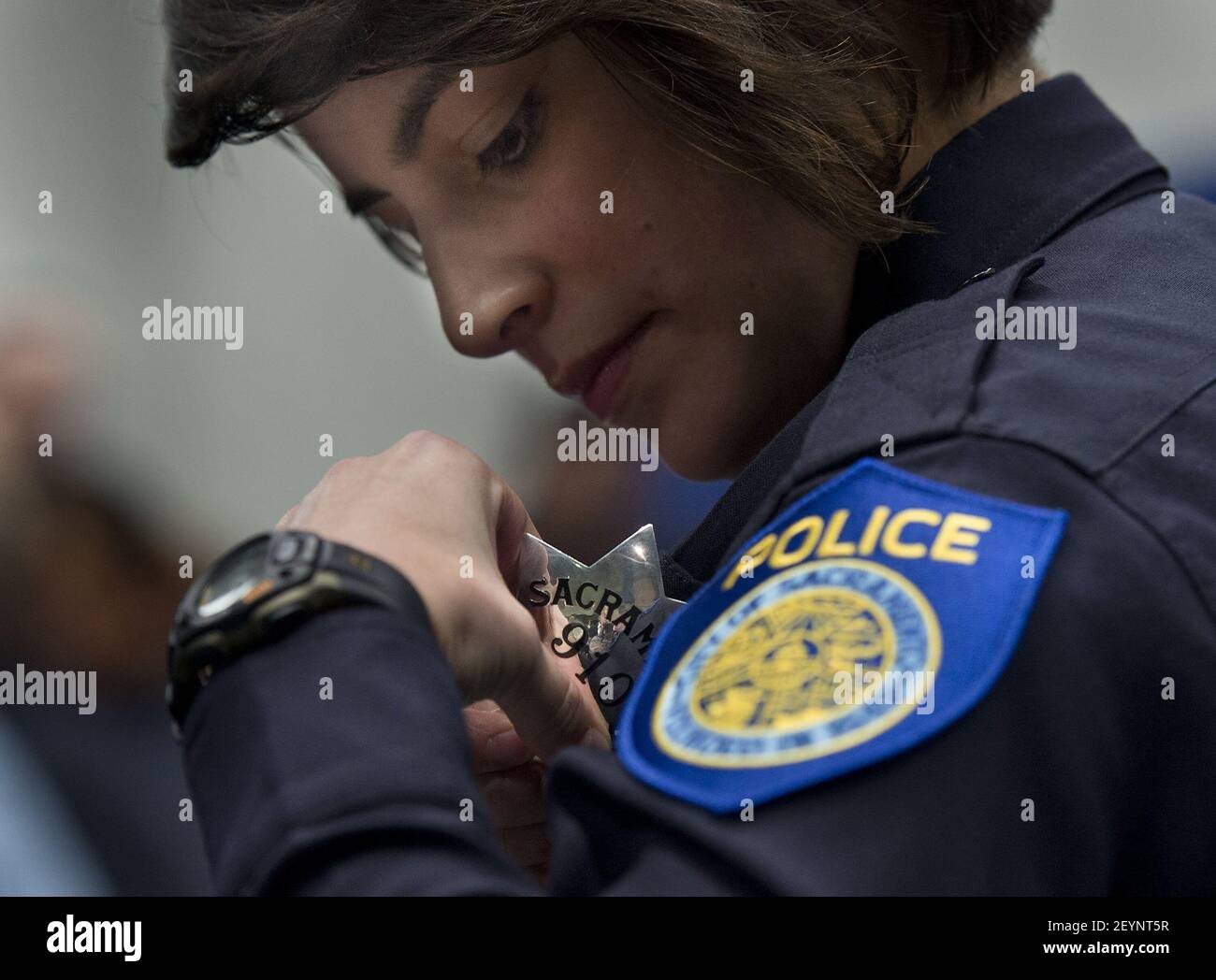 Emily Kane adjusts her new badge during the Sacramento Police ...