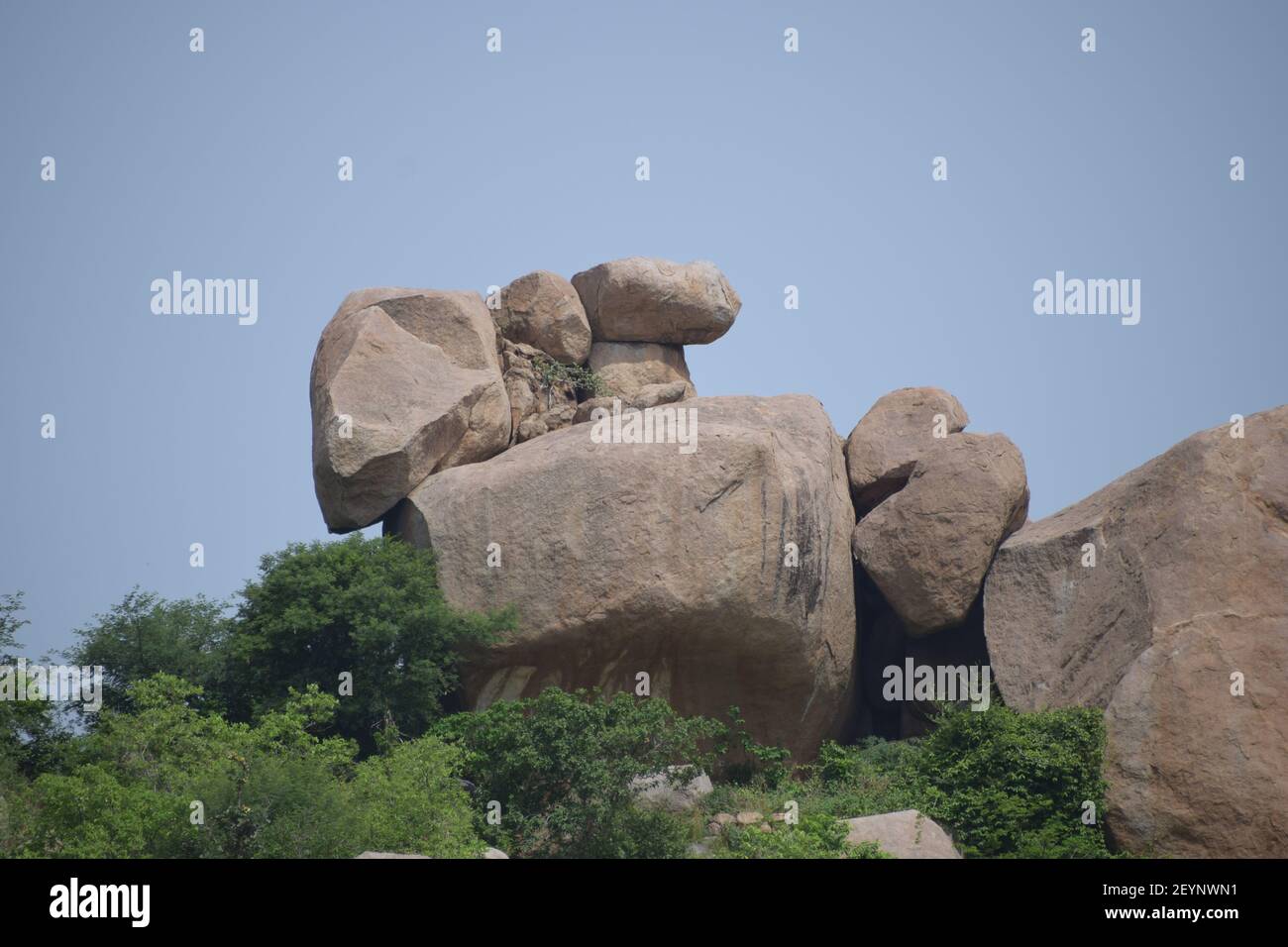 A closeup shot of big rocks on a hill under a clear blue sky Stock ...