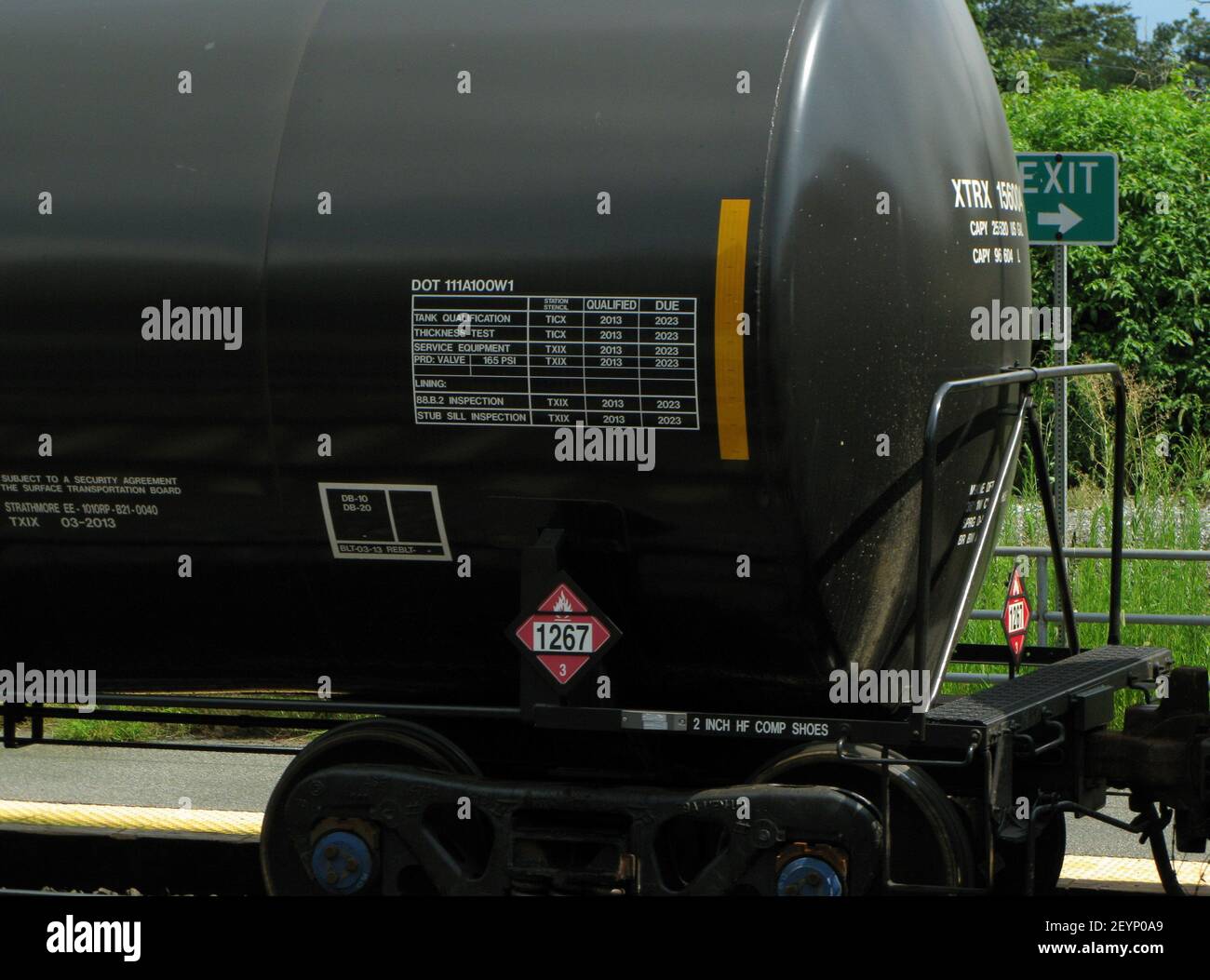 A DOT-111A tank car rolls past the Amtrak platform at Newark, Del., on ...
