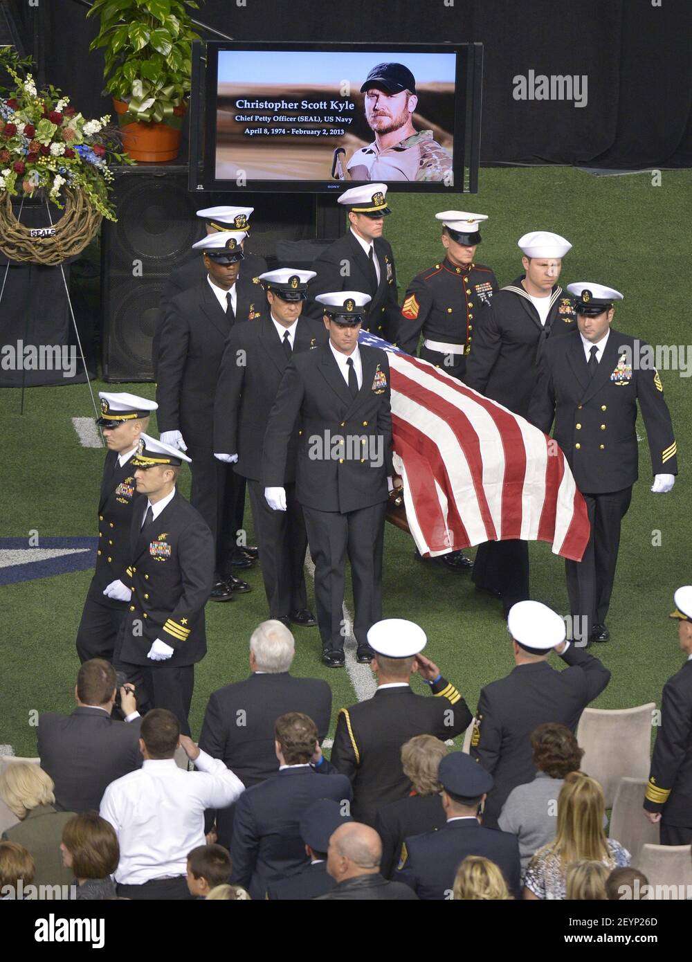 Members of the military carry the casket of Chris Kyle at Cowboys ...