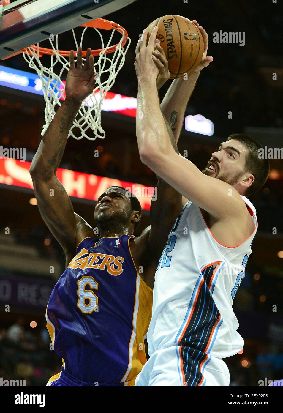 The Charlotte Bobcats' Byron Mullens (22) battles for control of a ...
