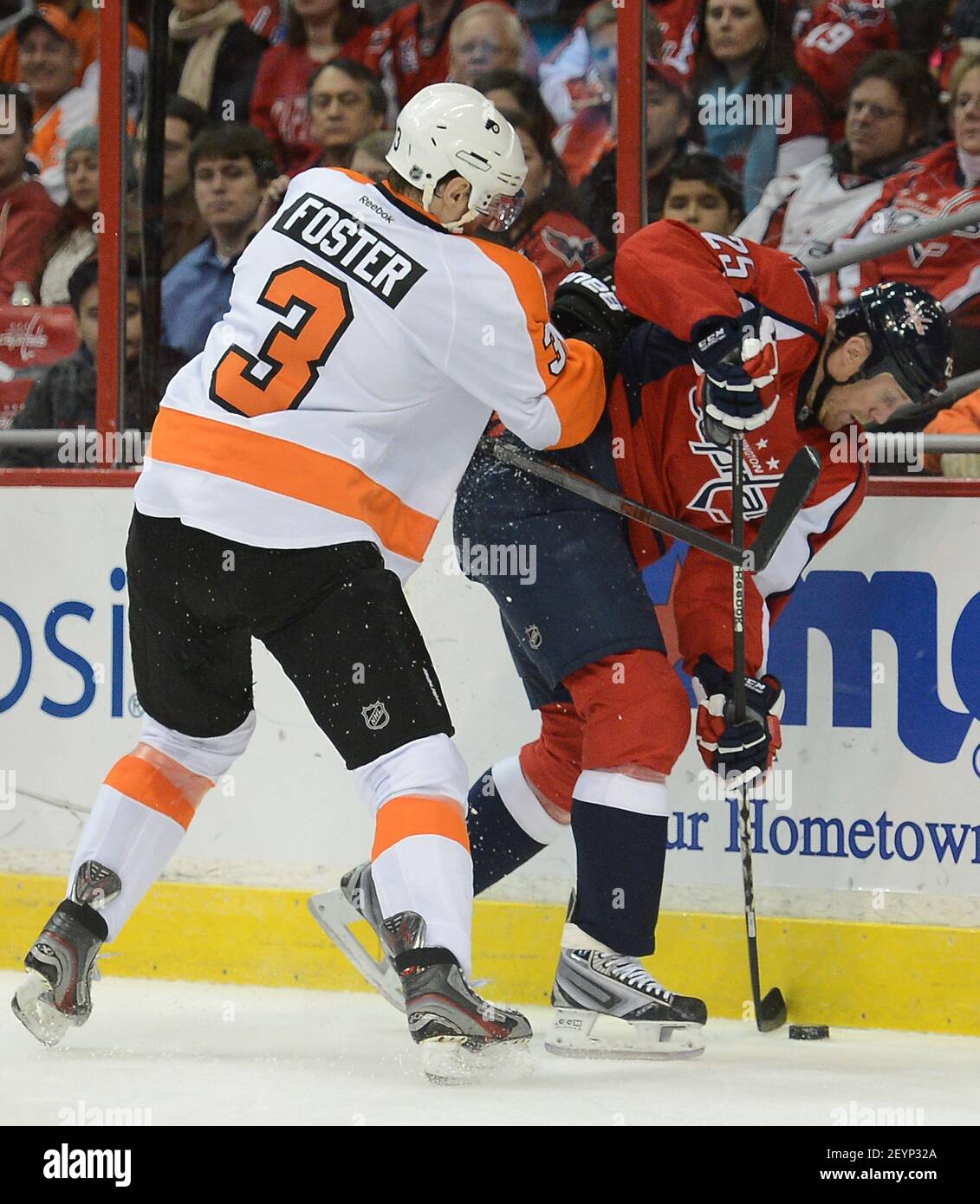 Philadelphia Flyers defenseman Kurtis Foster (3) knocks Washington ...
