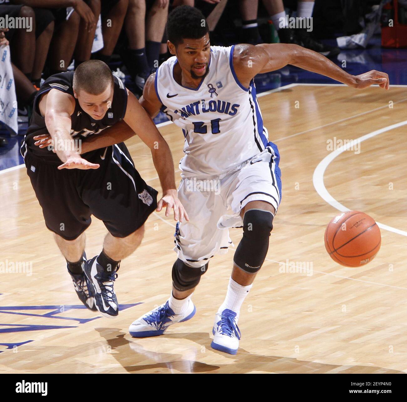 Saint Louis' Dwayne Evans, right, steals the ball from Butler's Chase ...