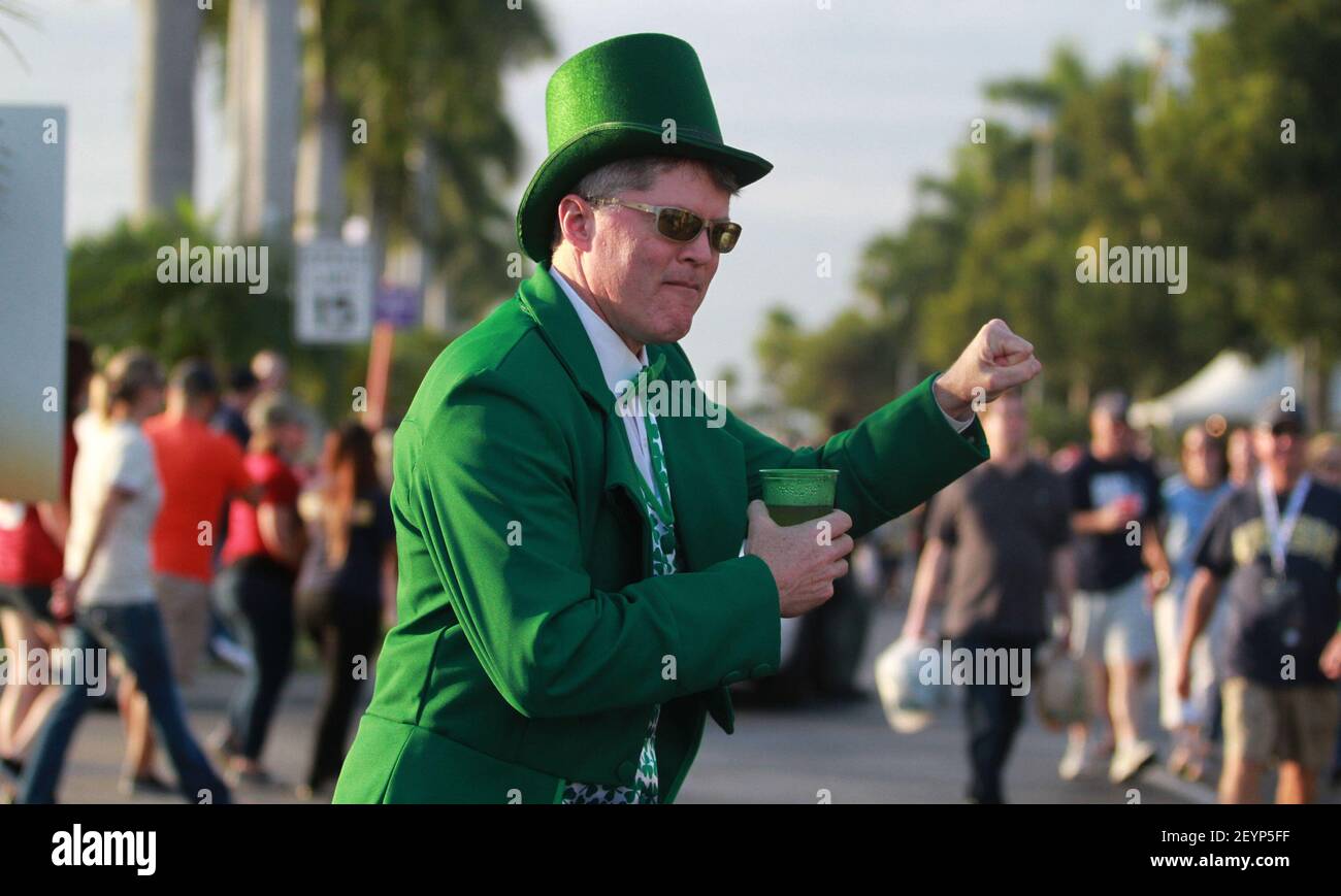 University of Notre Dame fan Ken Herlihy makes the pose of the team's ...