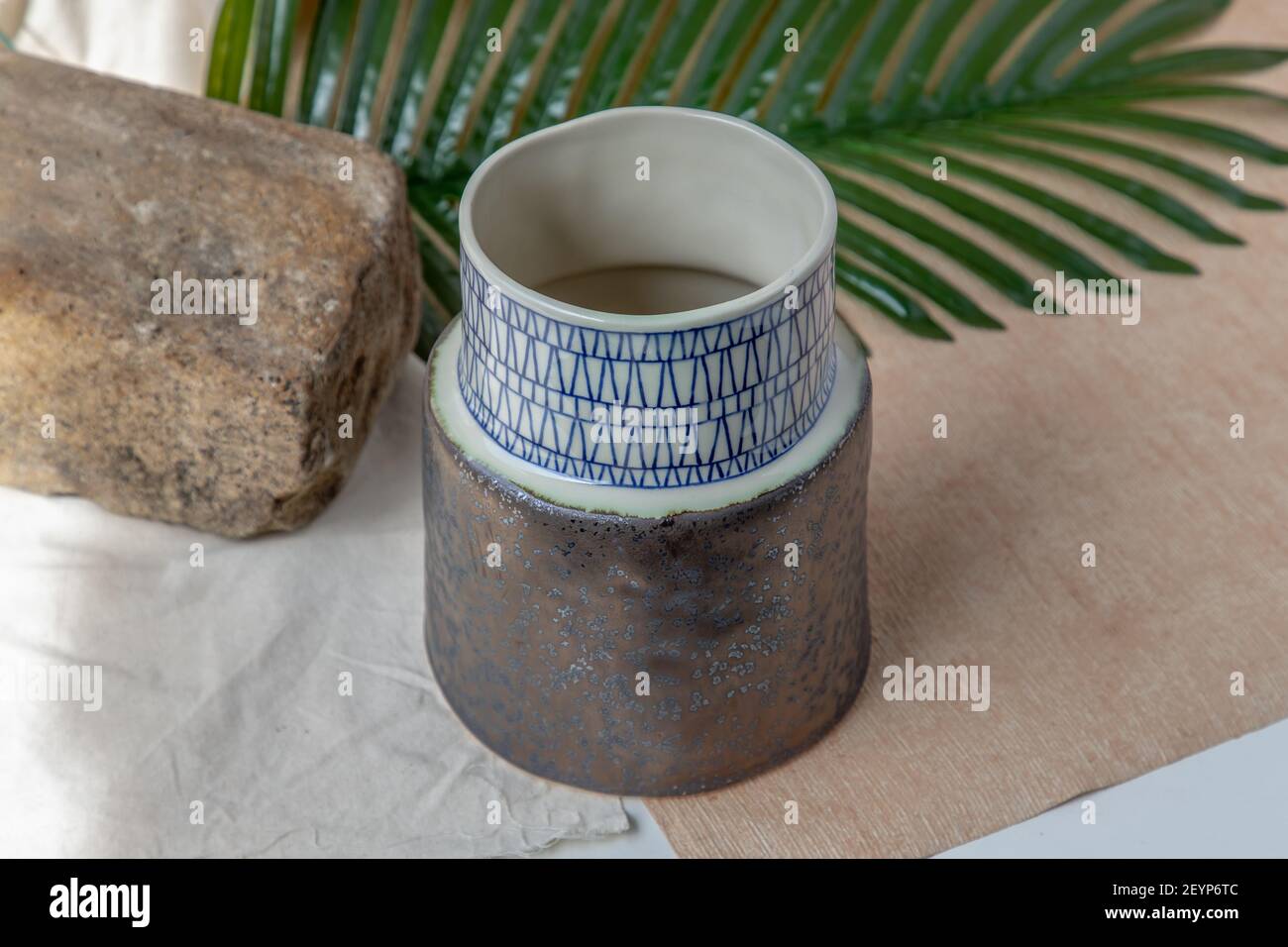 Handmade ceramic vase on white textured table cloth. Home decor, Copy ...