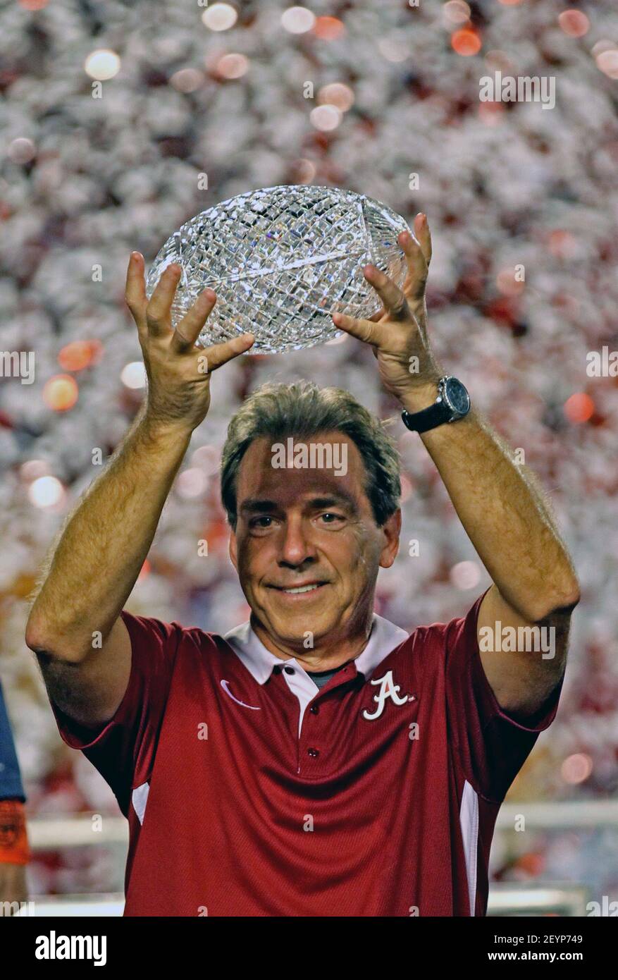 Alabama head coach Nick Saban hoists the trophy following a 42-14 win ...