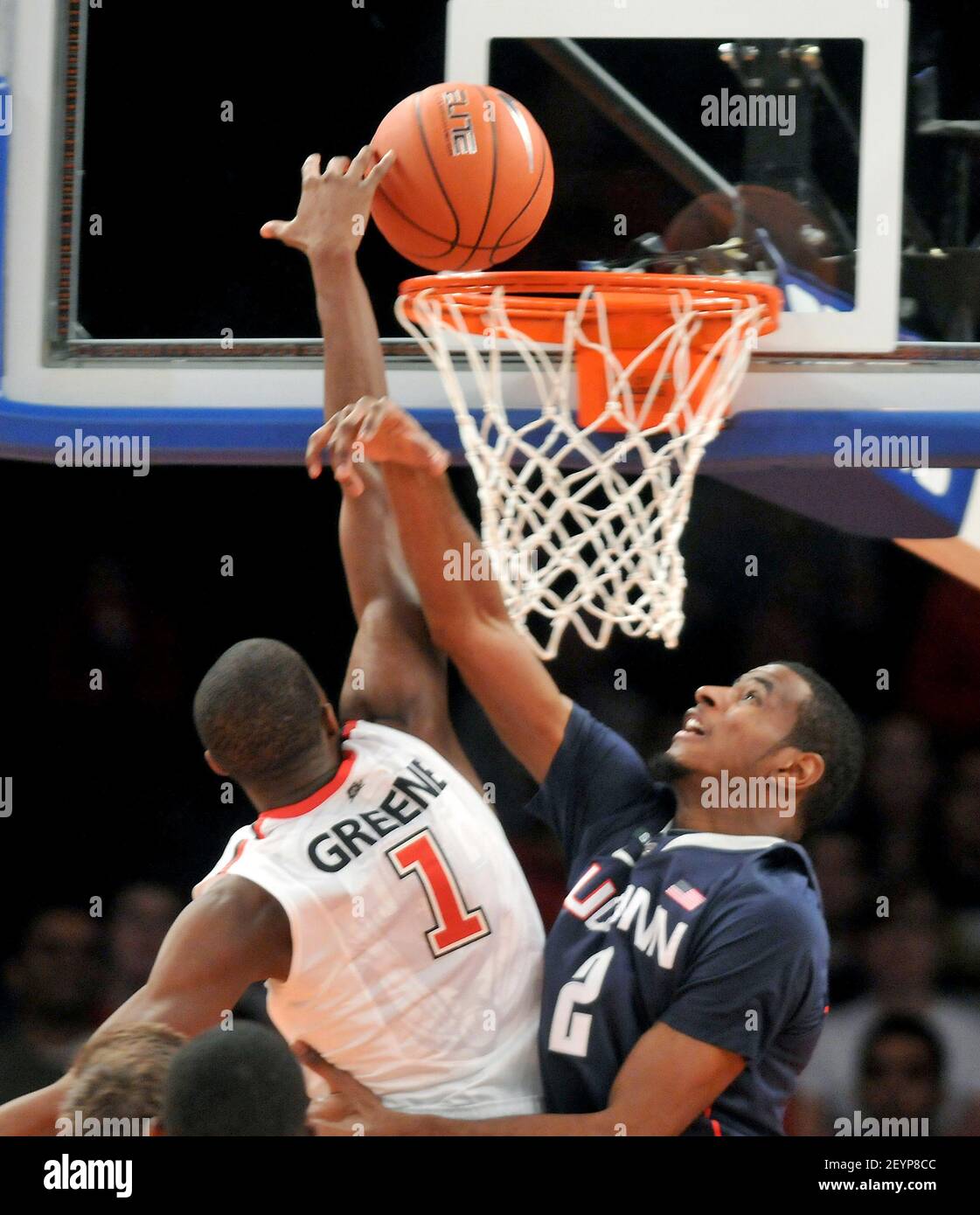 Connecticut's DeAndre Daniels tries to block St. John's guard Phil ...