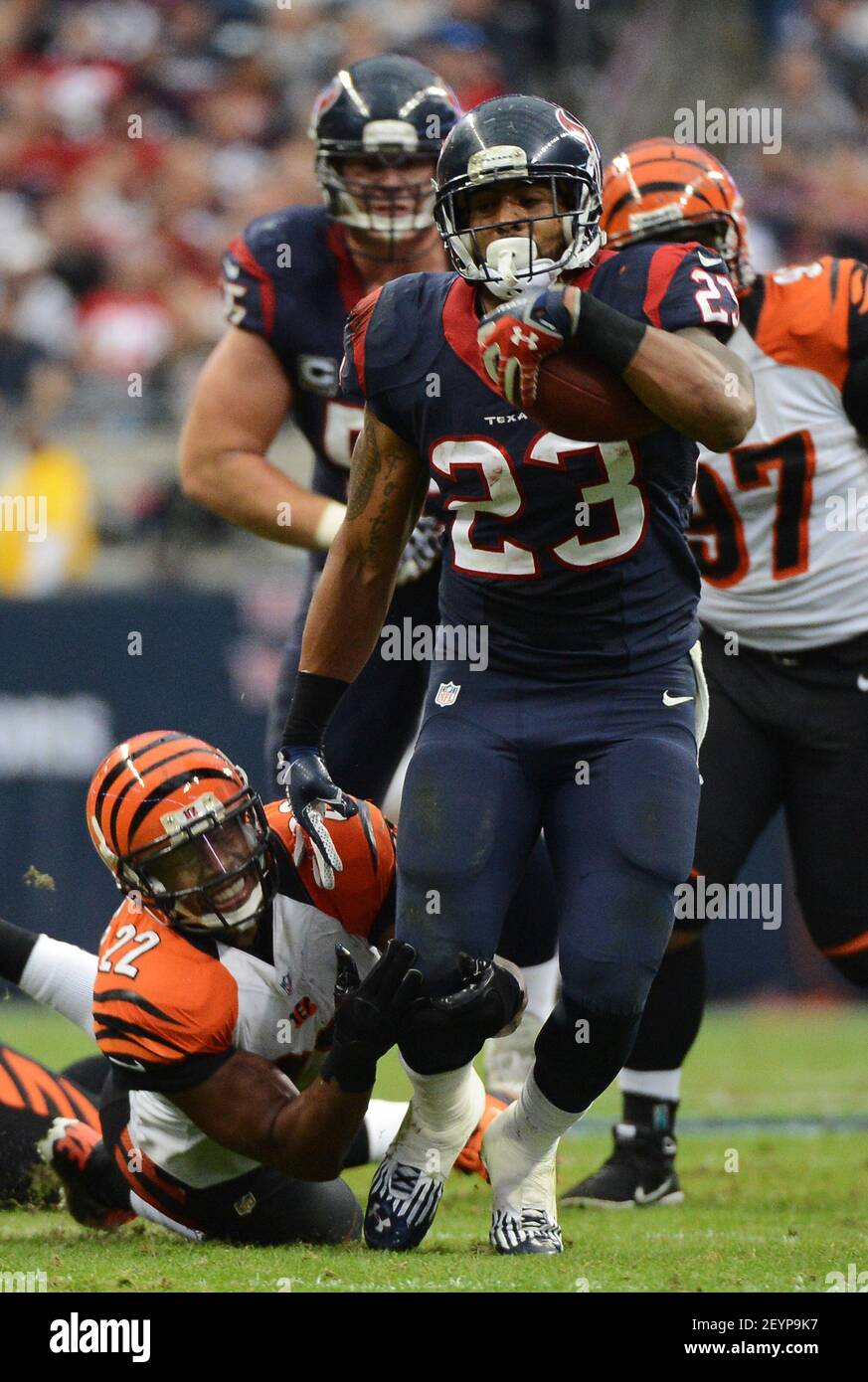 Arian Foster (23) of the Houston Texans is tackled by Nate Clements (22 ...