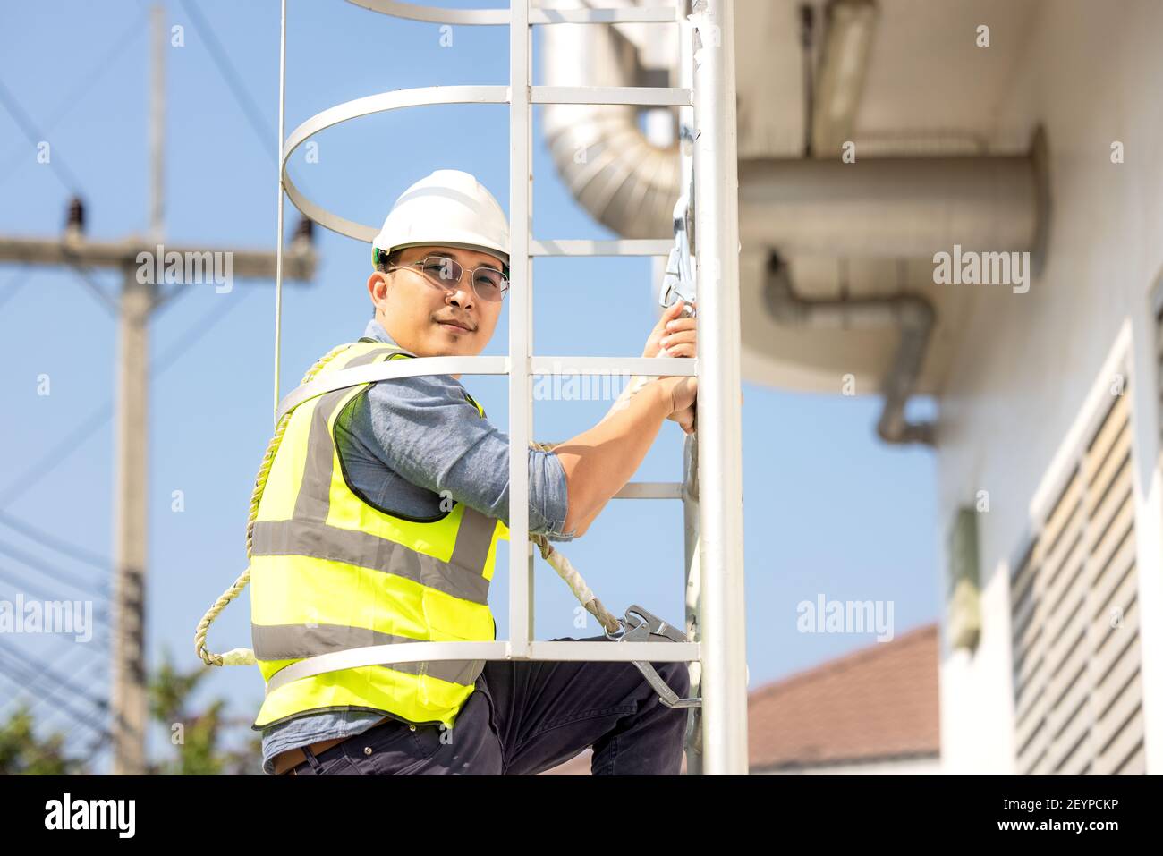 Man climbing steel ladder hi-res stock photography and images - Alamy