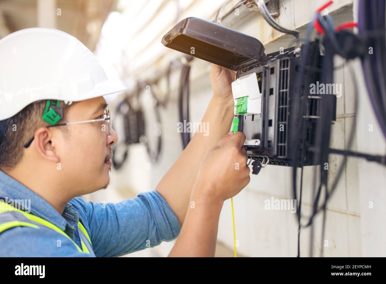 Engineer repair connector the fibers on splitter tray close-up outside ...