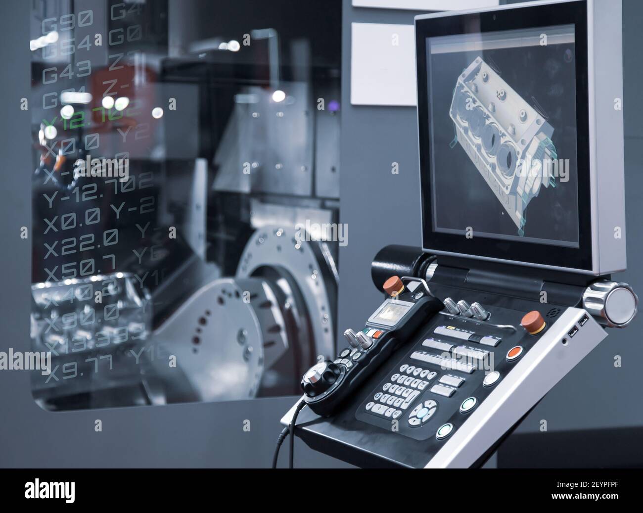Control panel of 5-axis CNC milling machine cutting automotive engine ...