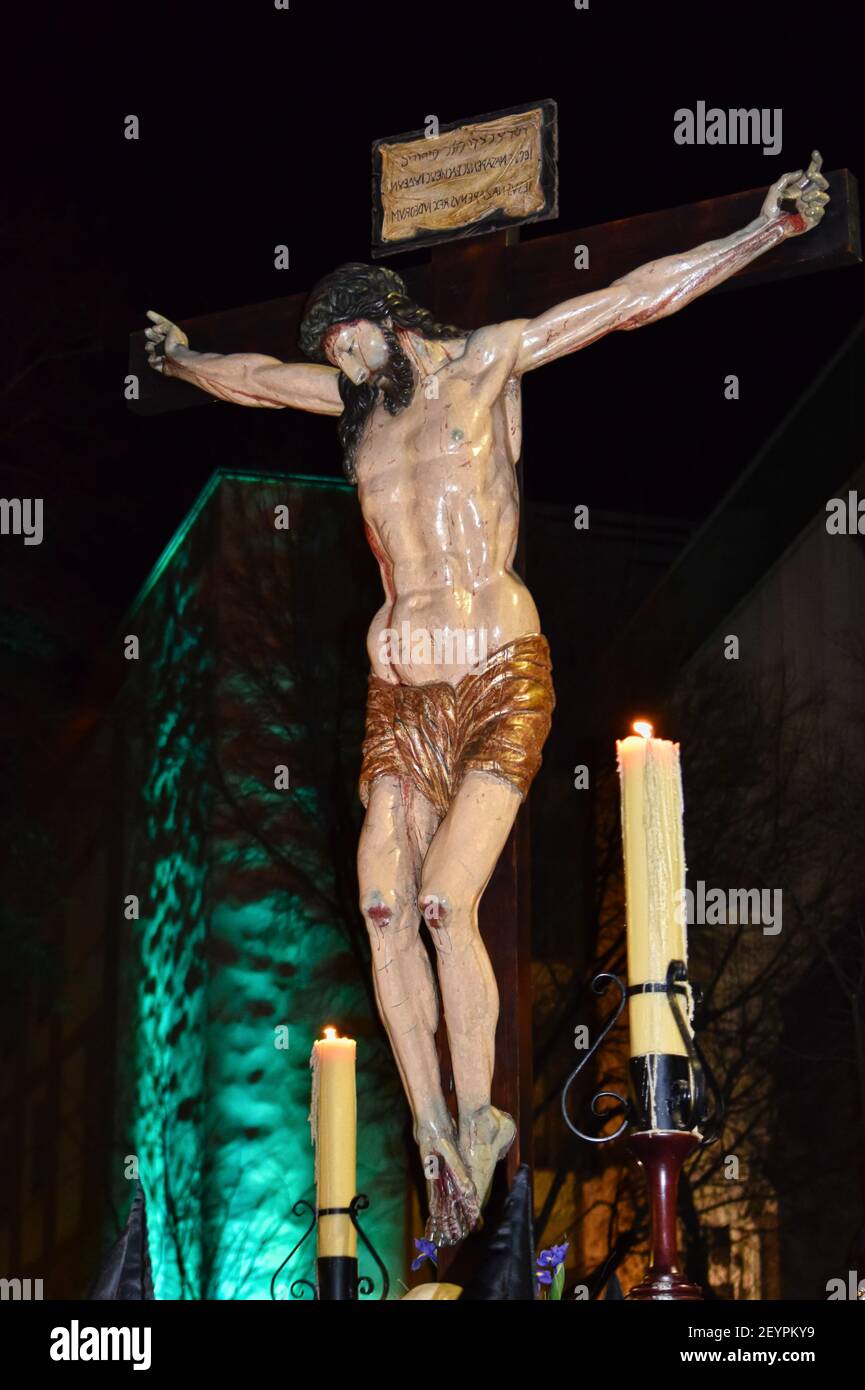 A vertical shot of a statue showing the crucifixion of Jesus Christ in Valladolid during Holy ...