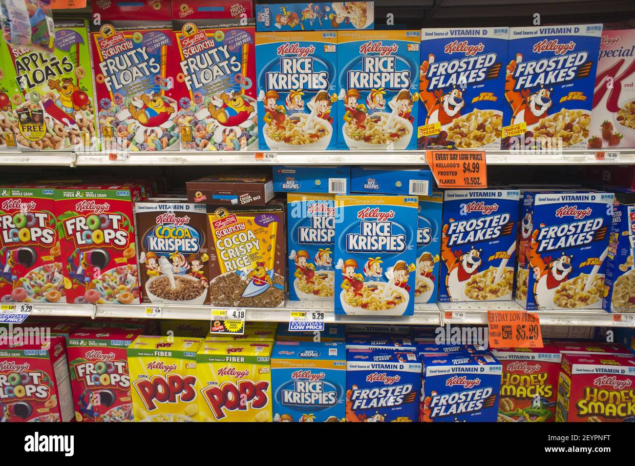 Boxes of Kellogg's breakfast cereals with generic brands mixed in on grocery store shelves in ...