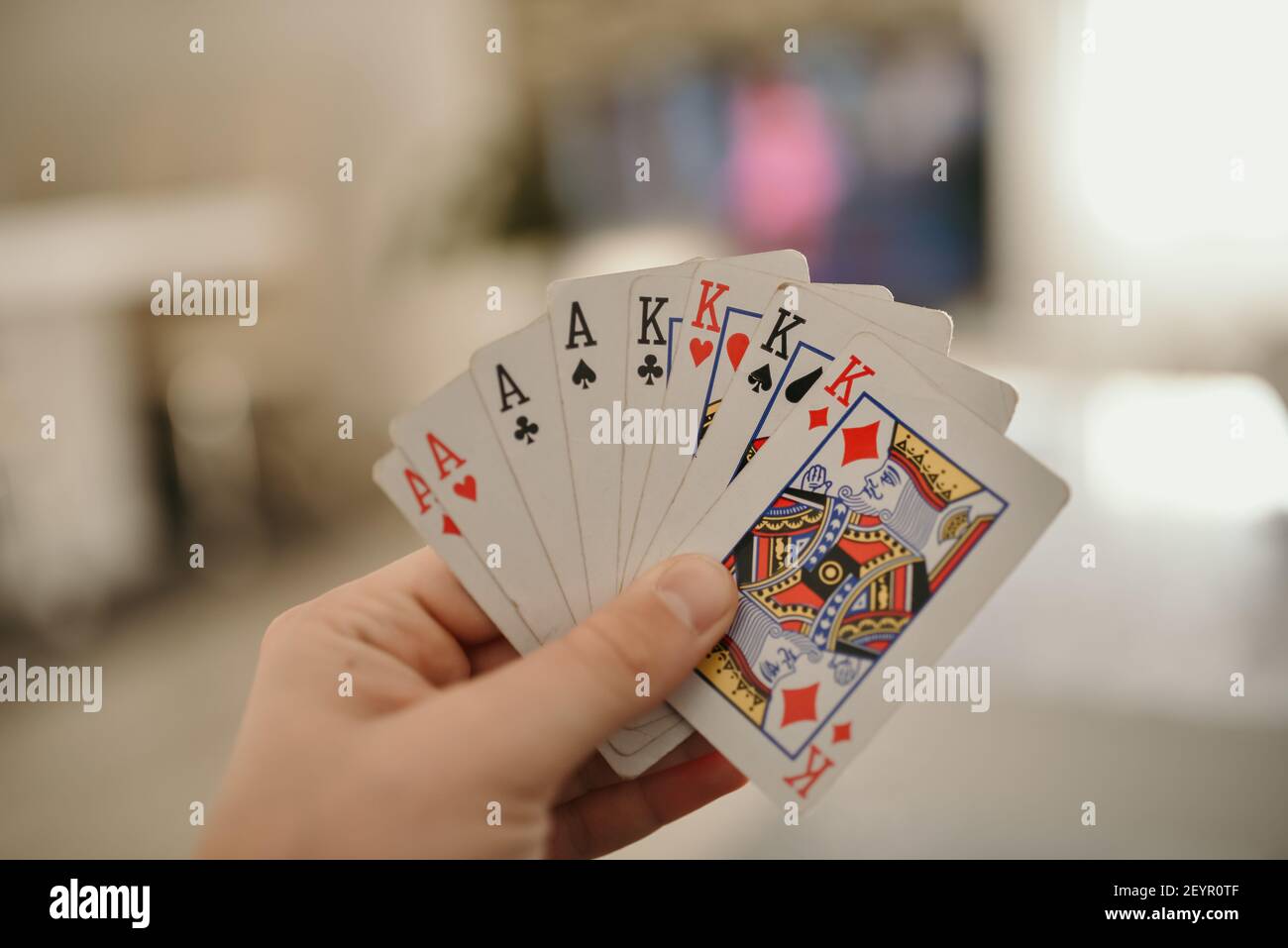 A closeup shot of hands holding playing cards Stock Photo - Alamy