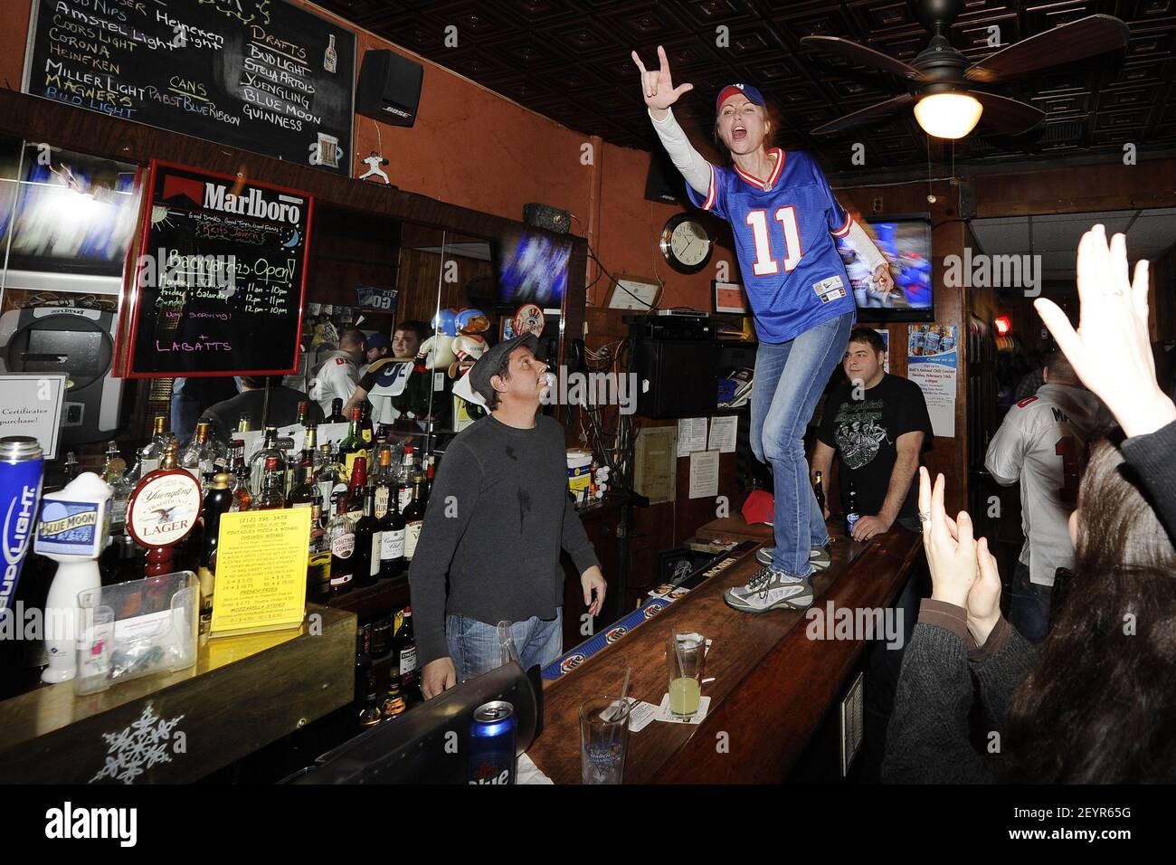 22 January 2012 - New York - Taryn Reif, owner of Reif's Tavern, jumps ...