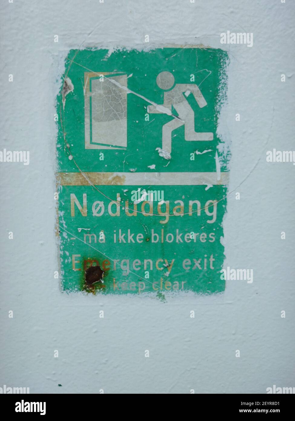 Emergency exit sign on a ferry in Croatia. It was built and used in ...