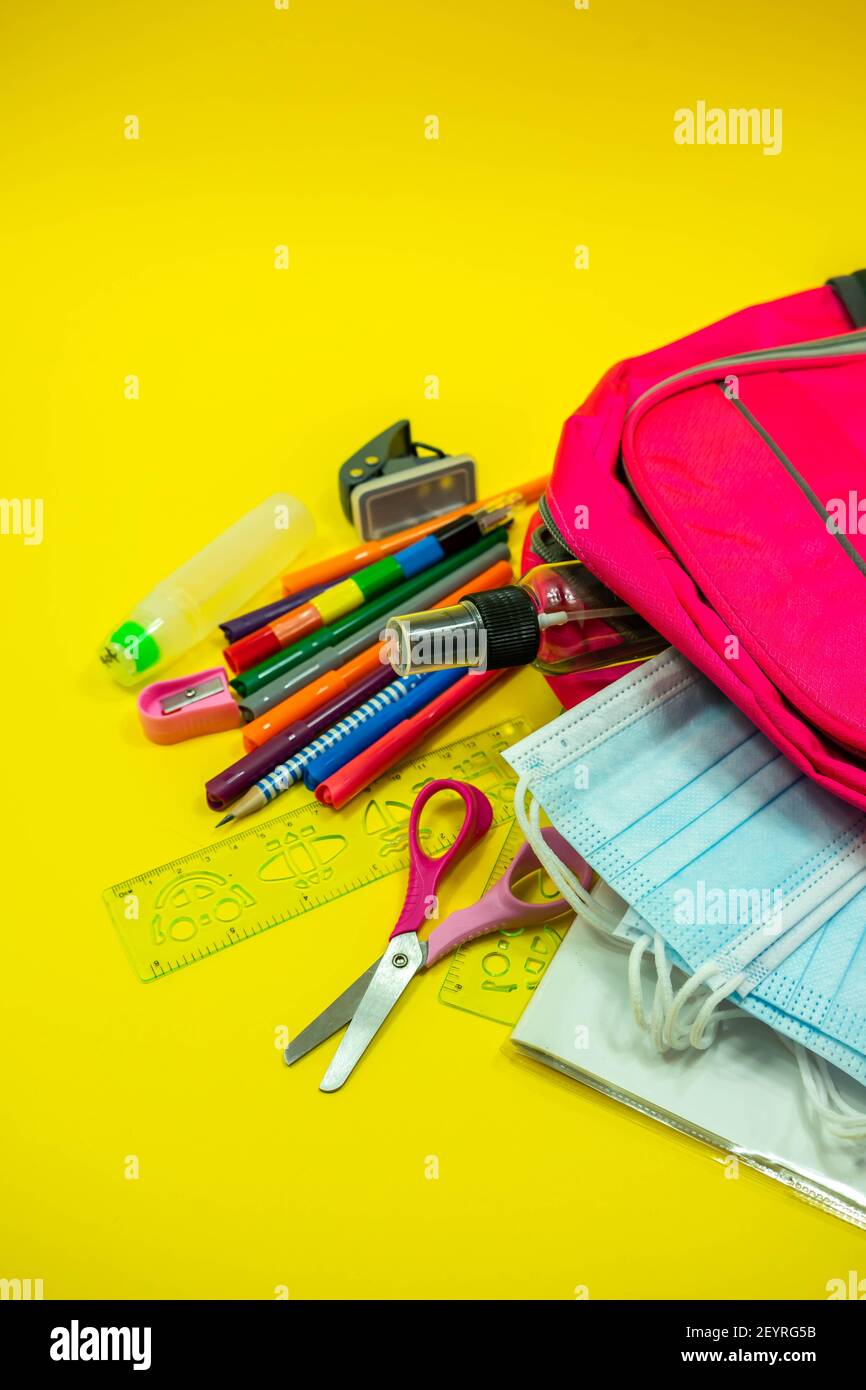 School supplies like pencil scissor eraser ruler watercolor mask ...