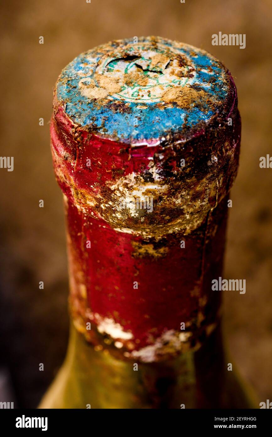 Damaged metal cap of an old red wine bottle, Lyon, France Stock Photo ...