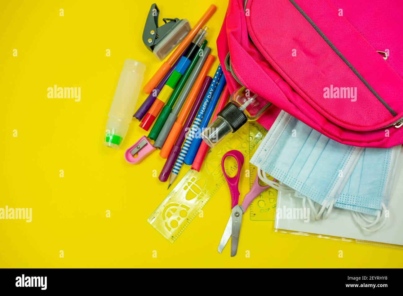 School supplies like pencil scissor eraser ruler watercolor mask ...