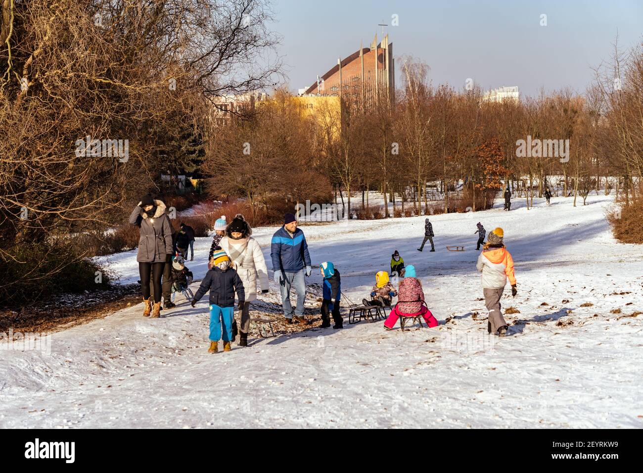 POZNAN, POLAND - Jan 17, 2021: Adults and children walking up a snowy ...
