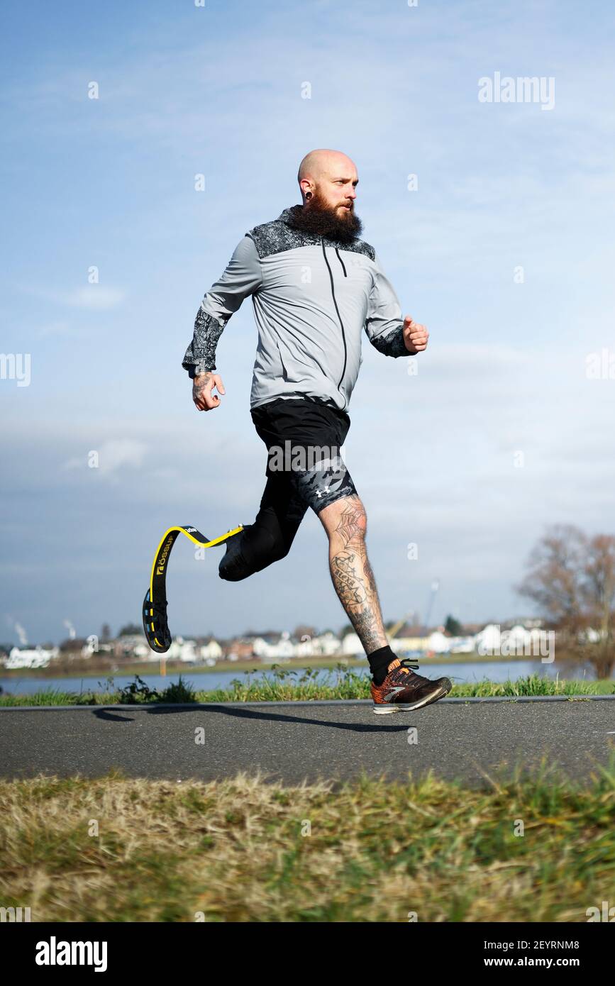 run training with sports prosthesis Stock Photo - Alamy