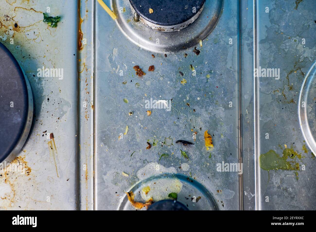 Dirty gas stove top with food leftovers. Unclean steel kitchen cooktop ...