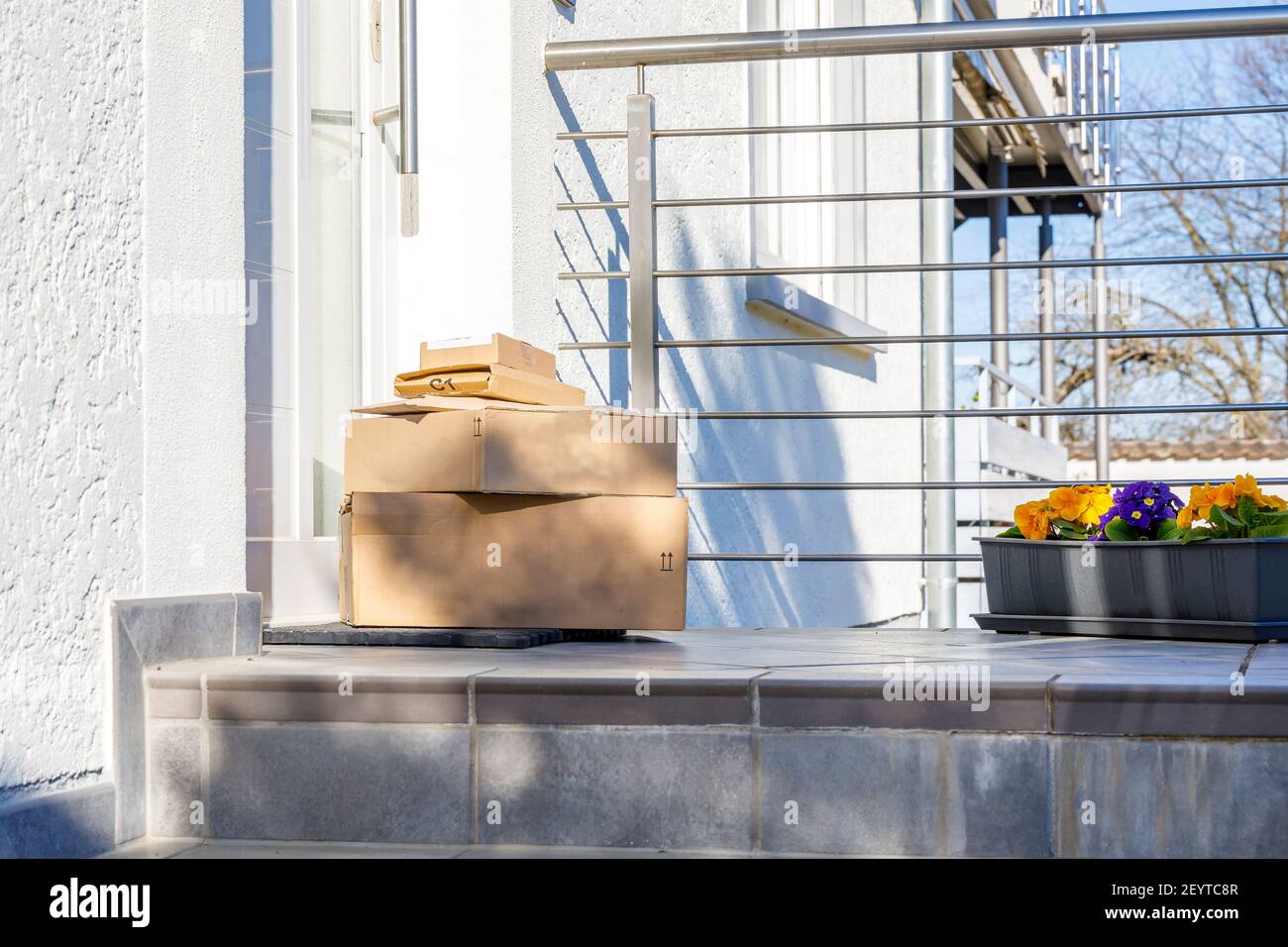 Parcels placed on the doorstep Stock Photo - Alamy