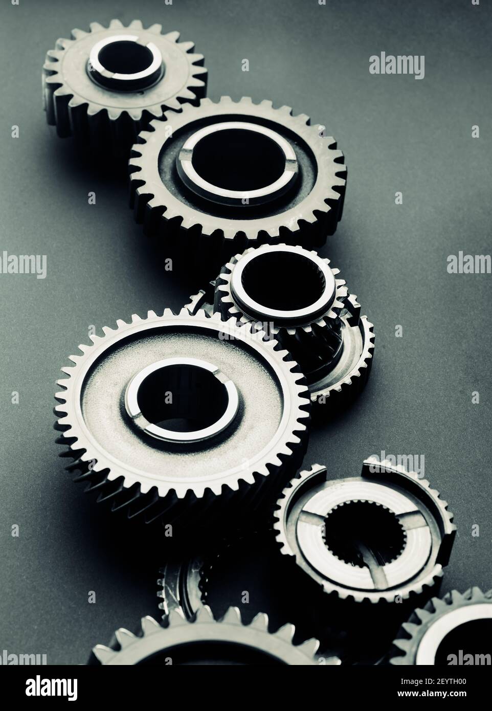 Industrial gears and cogs on paper background. Copy space. Blue tint ...