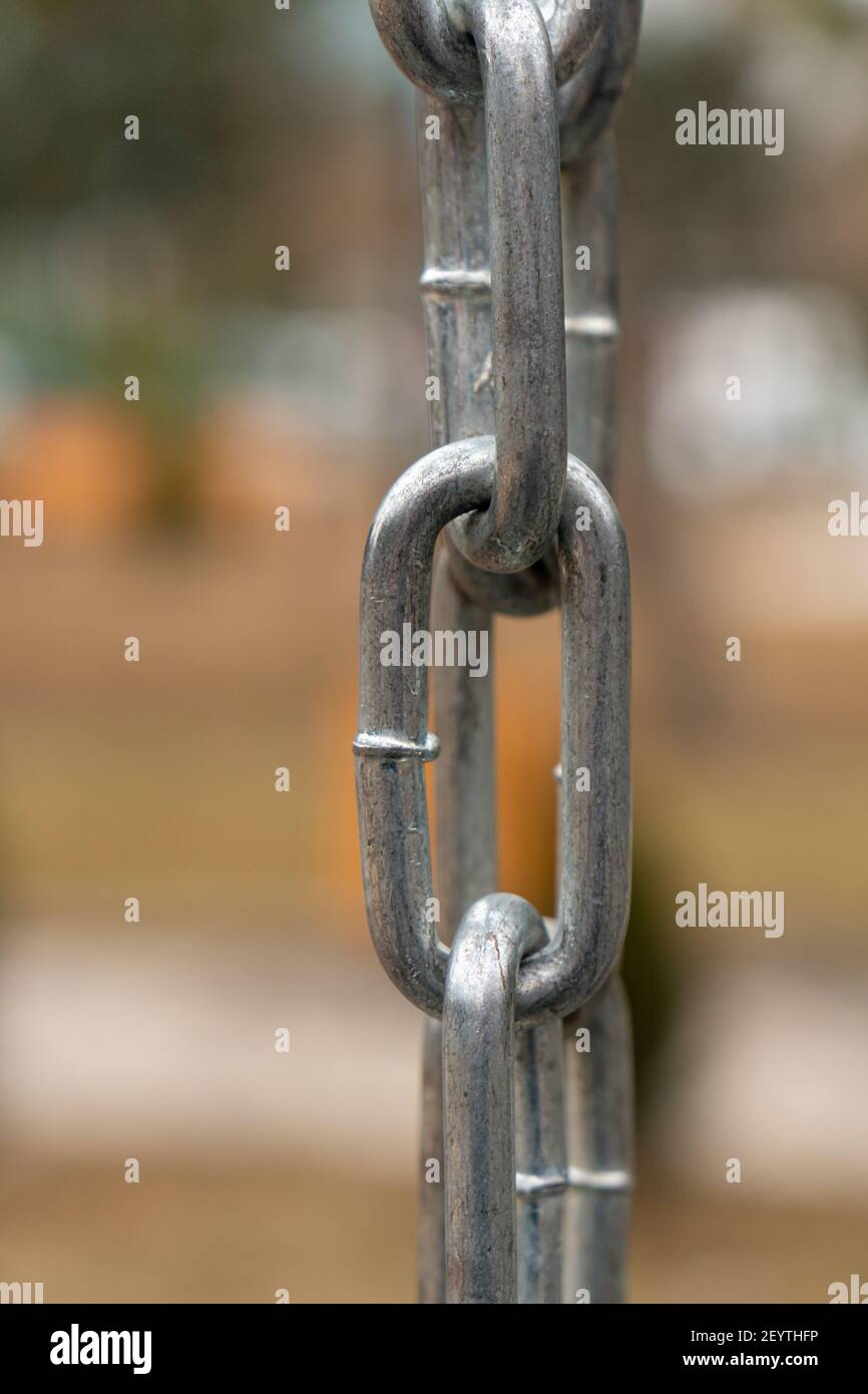 Strong shiny silver chain, outdoors, park background. Object Stock ...