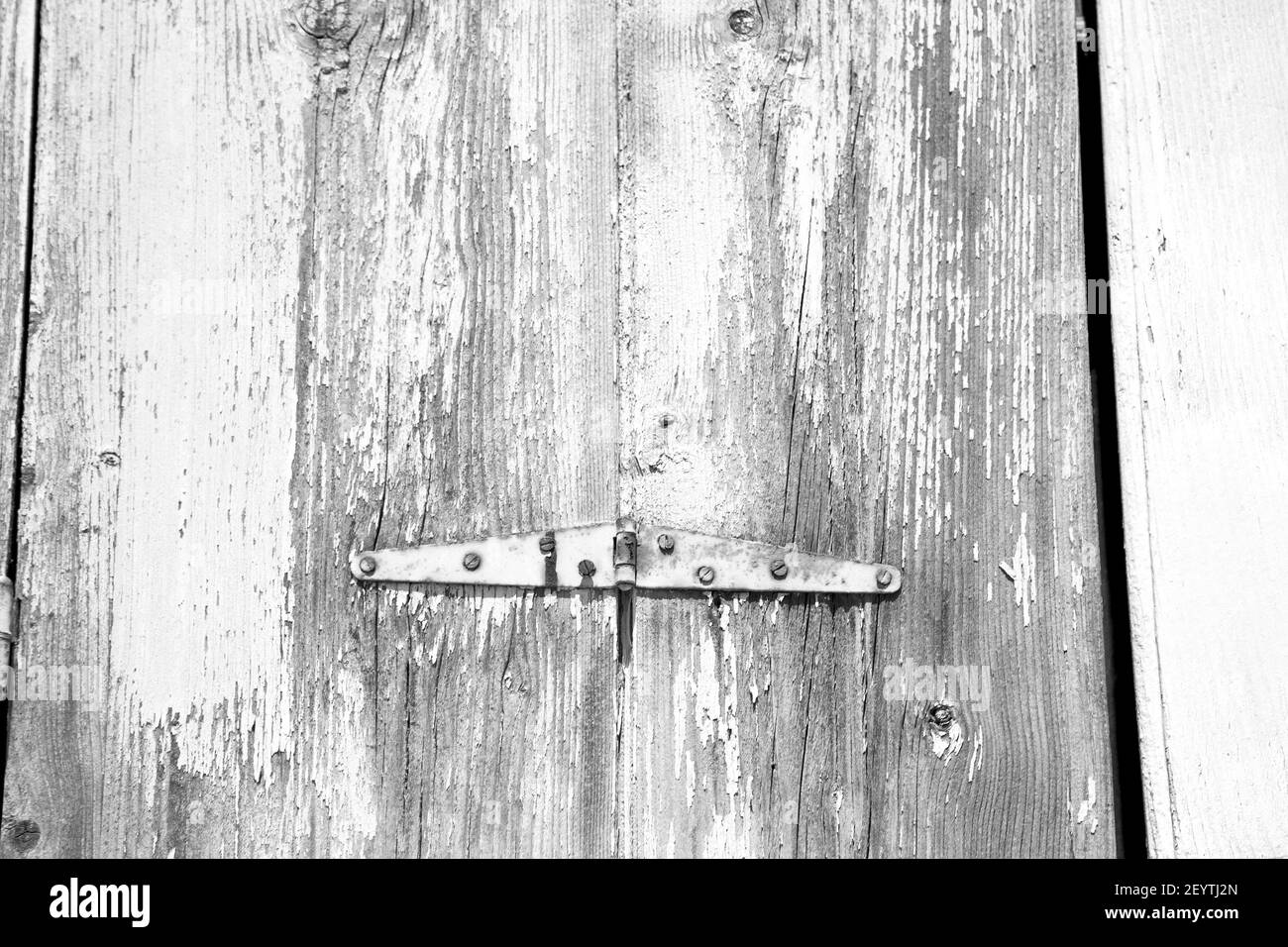 In the old wall a hinged window green wood and rusty metal Stock Photo ...