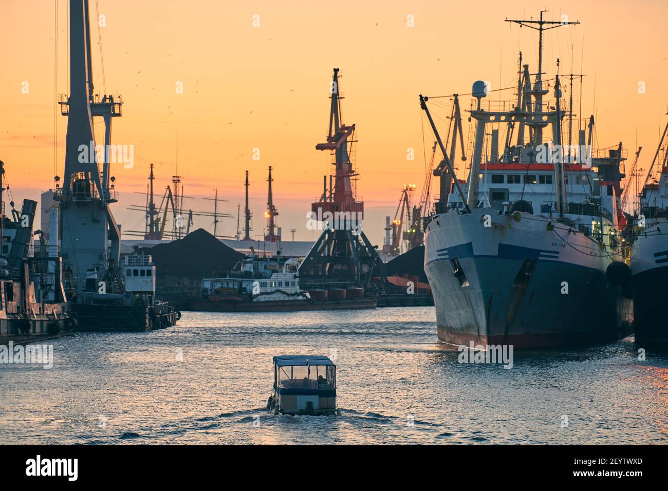 Ships in sea port on sunset background. Scenery industrial landscape ...