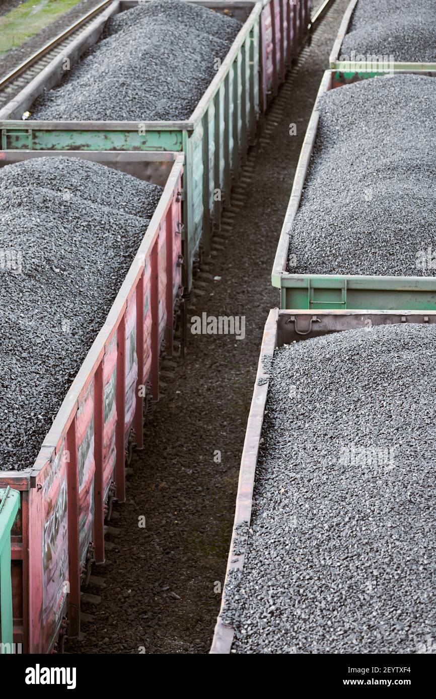 Railway cargo cars loaded with coal. Freight train transporting coal ...