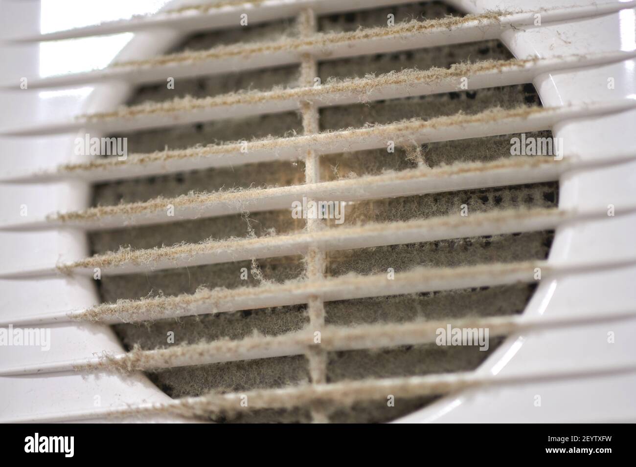 Extremely dirty air ventilation grill of HVAC with dusty clogged filter ...